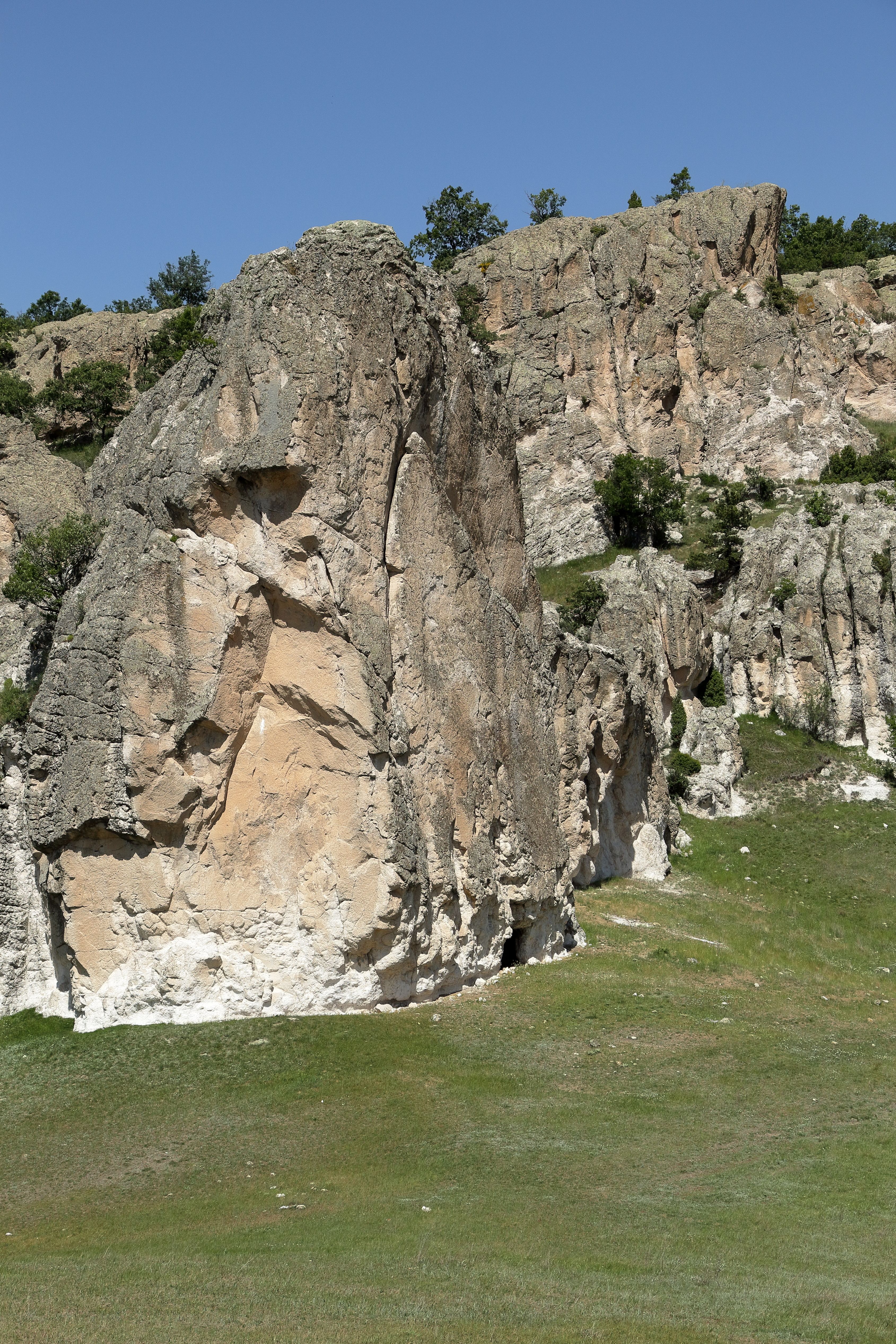 Majestic Rocky Cliff Formation Under Clear Blue Sky · Free Stock Photo