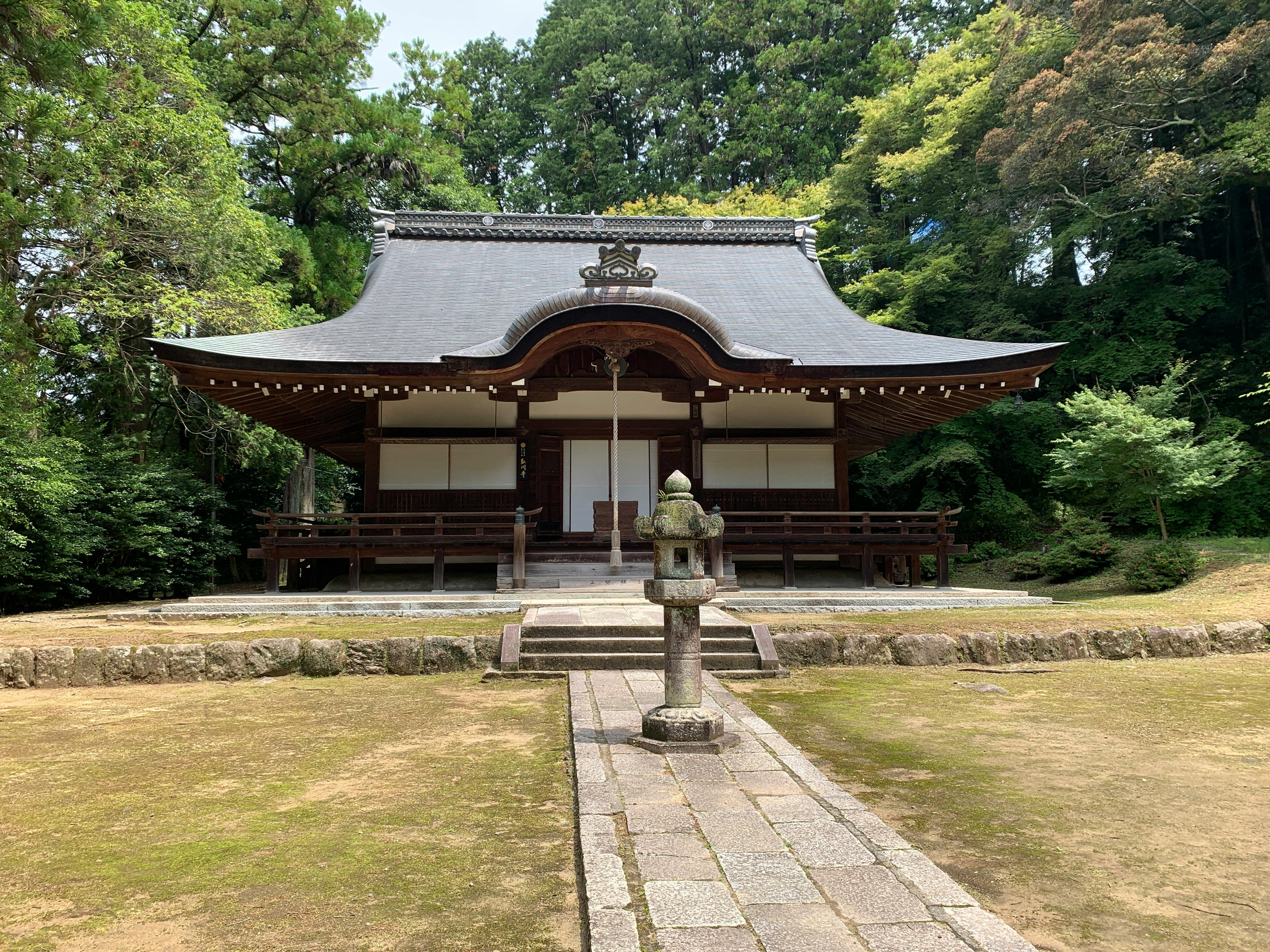 Serene Traditional Japanese Temple in Forest · Free Stock Photo