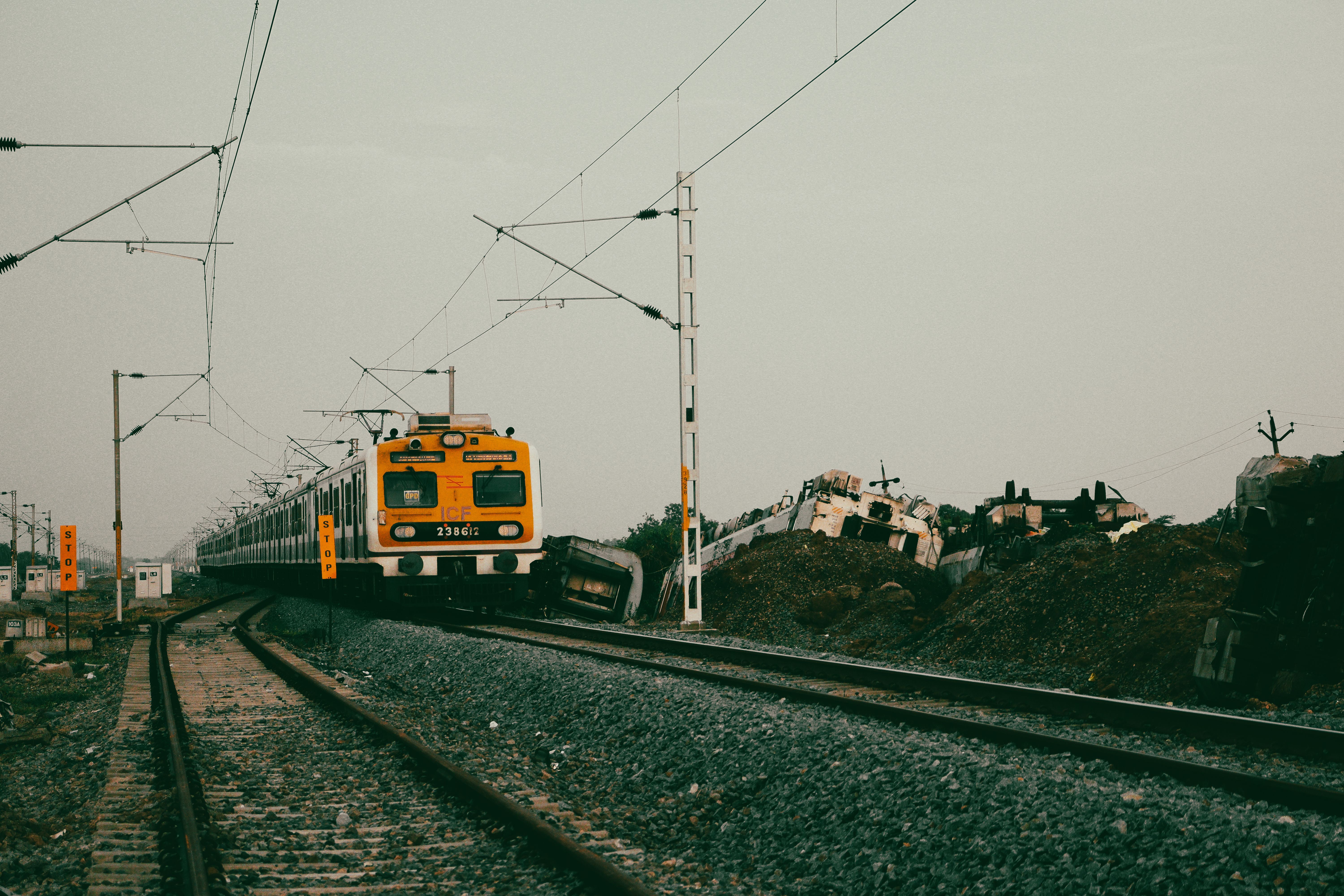 Commuter Train Passing Through Scenic Rail Tracks · Free Stock Photo