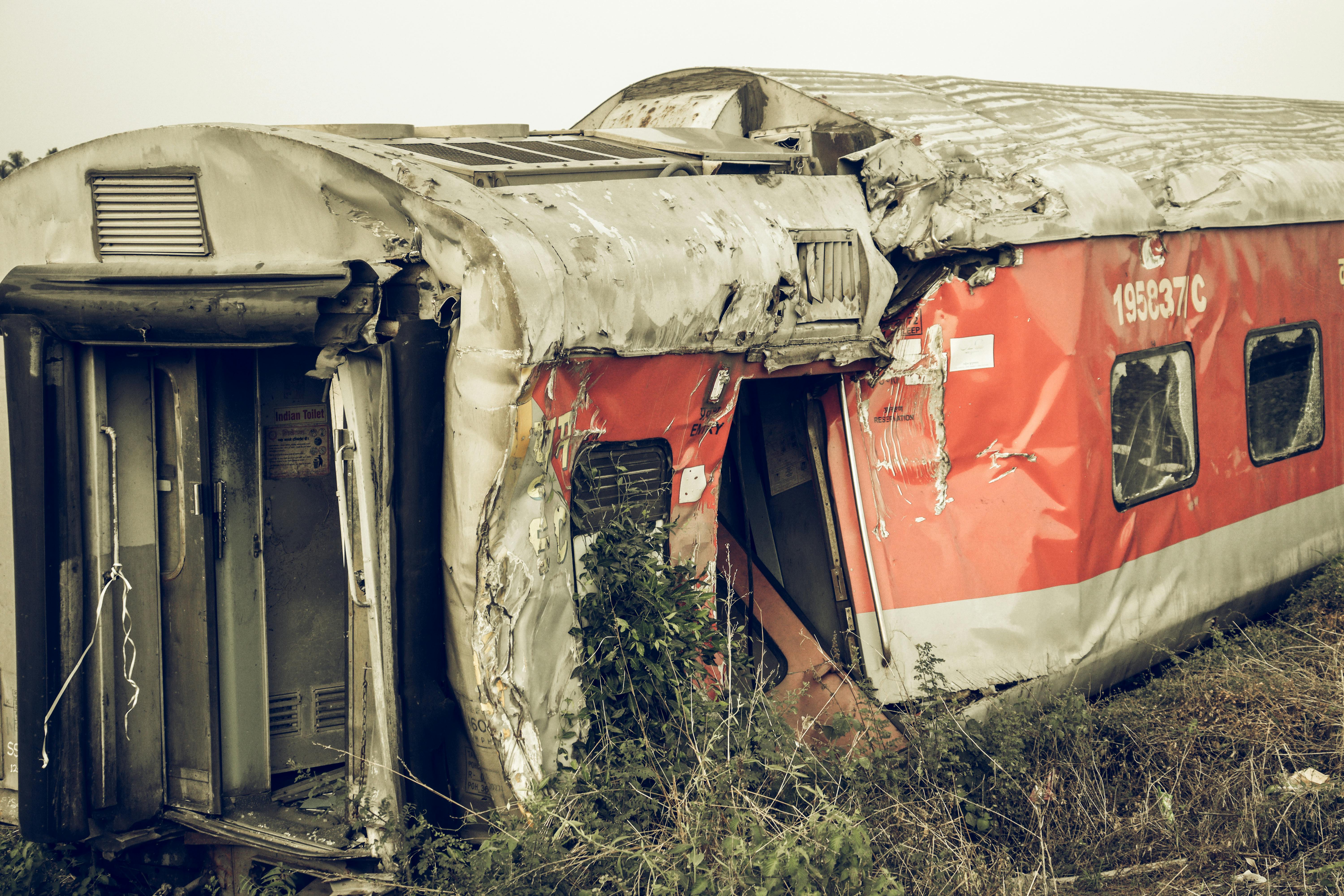 Rusty Train Wreck in Overgrown Field · Free Stock Photo