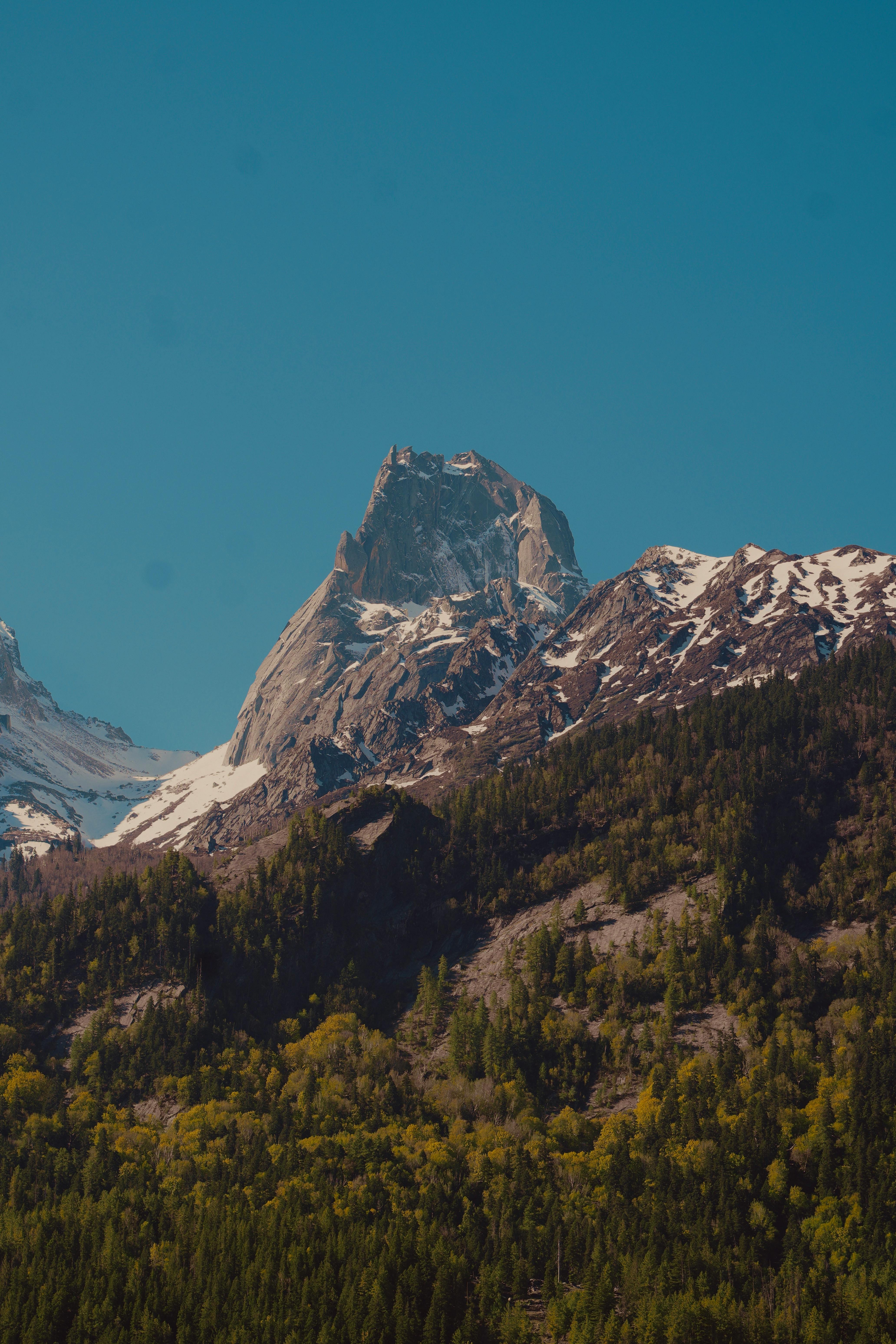Stunning Mountain Peak Under Clear Blue Sky · Free Stock Photo