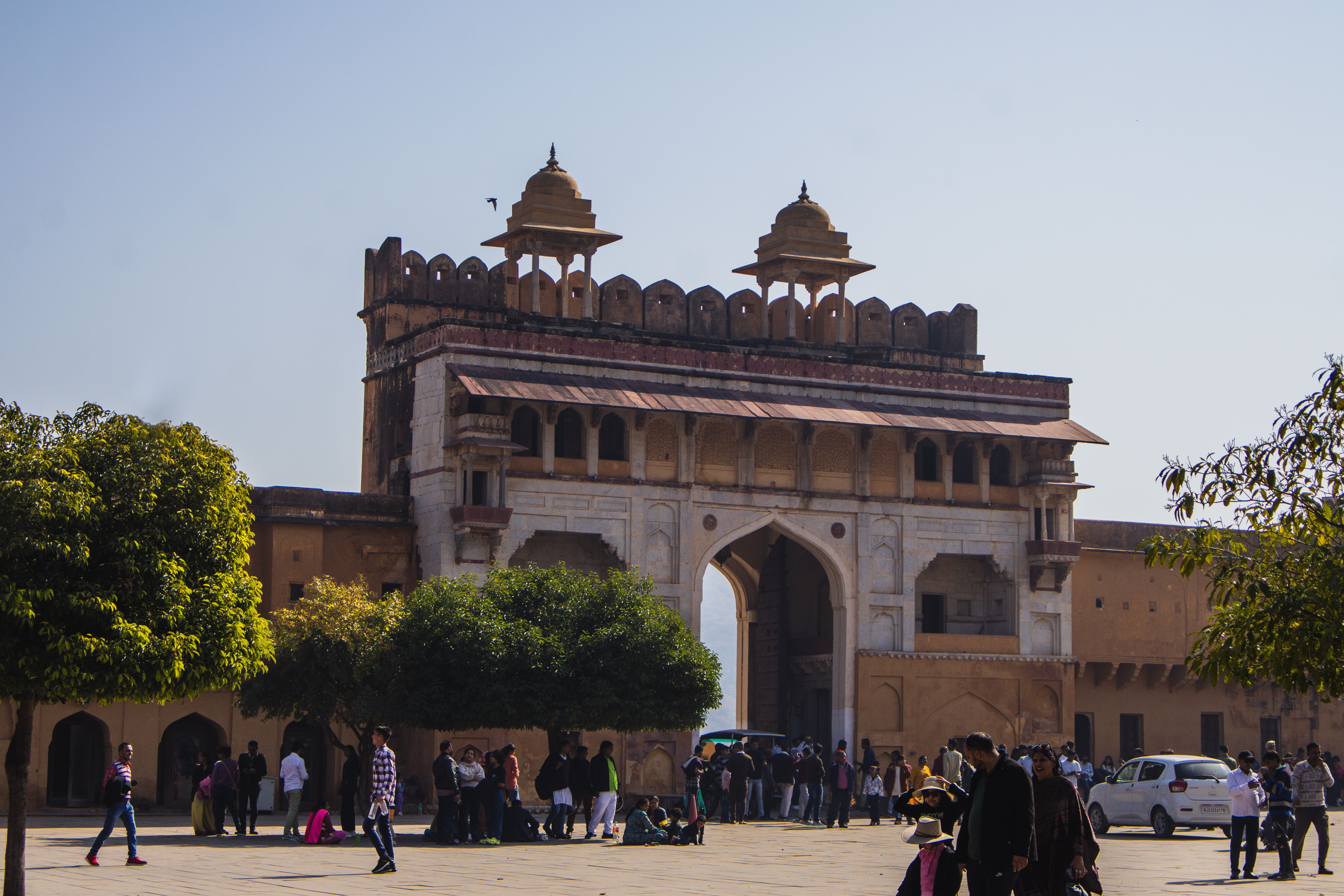 Amber Fort Gate with Tourists on a Sunny Day · Free Stock Photo