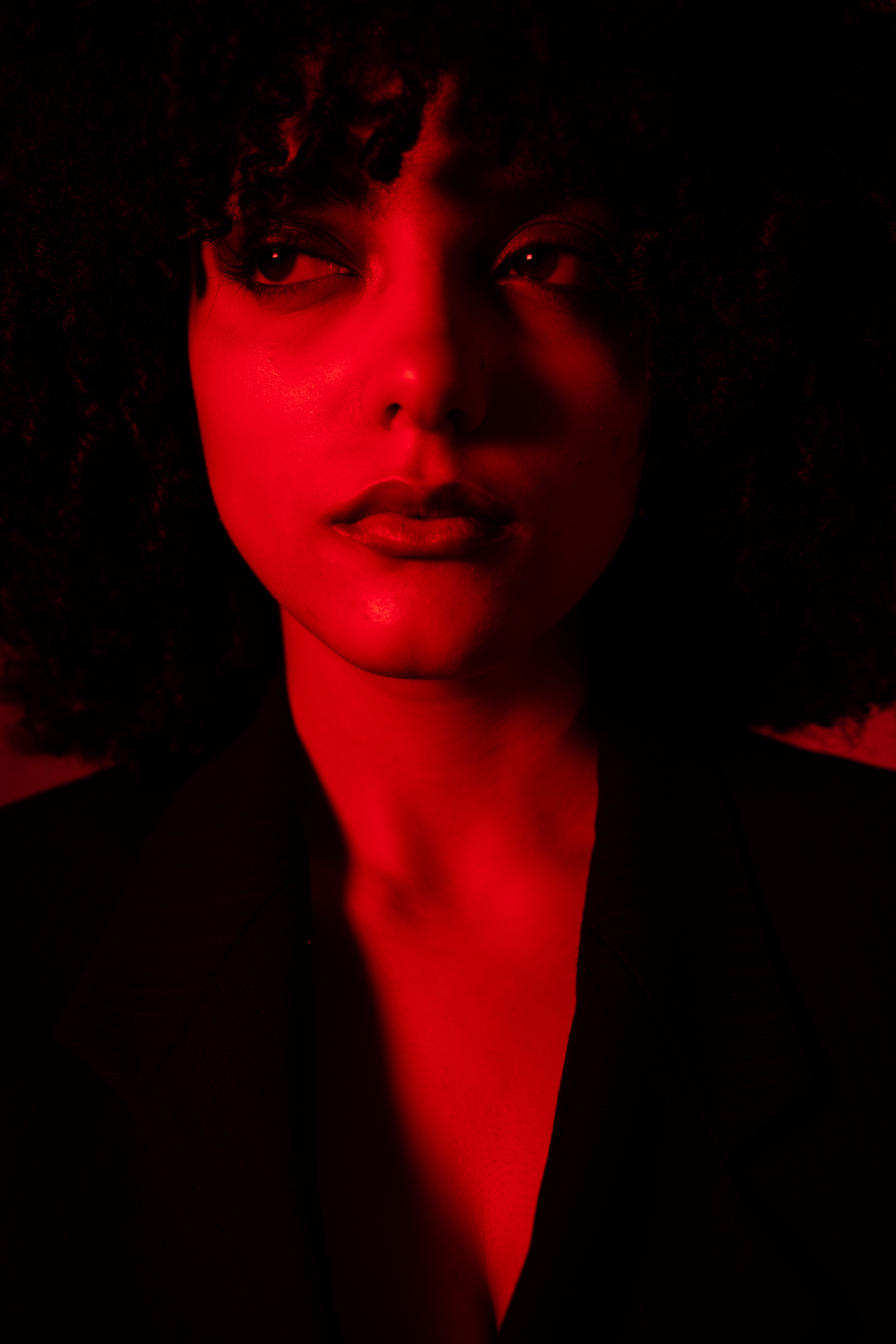 Elegant Portrait with Dramatic Red Lighting · Free Stock Photo