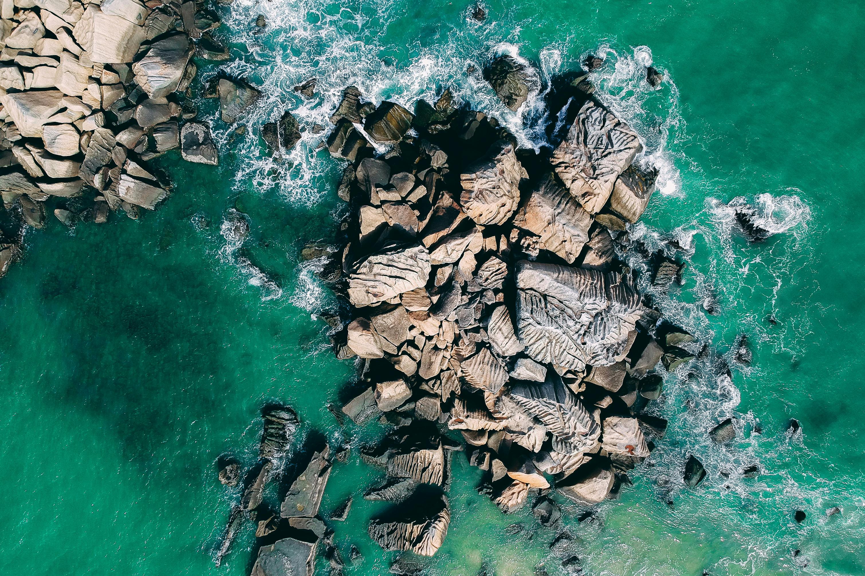 Aerial View of Seashore Rocks · Free Stock Photo