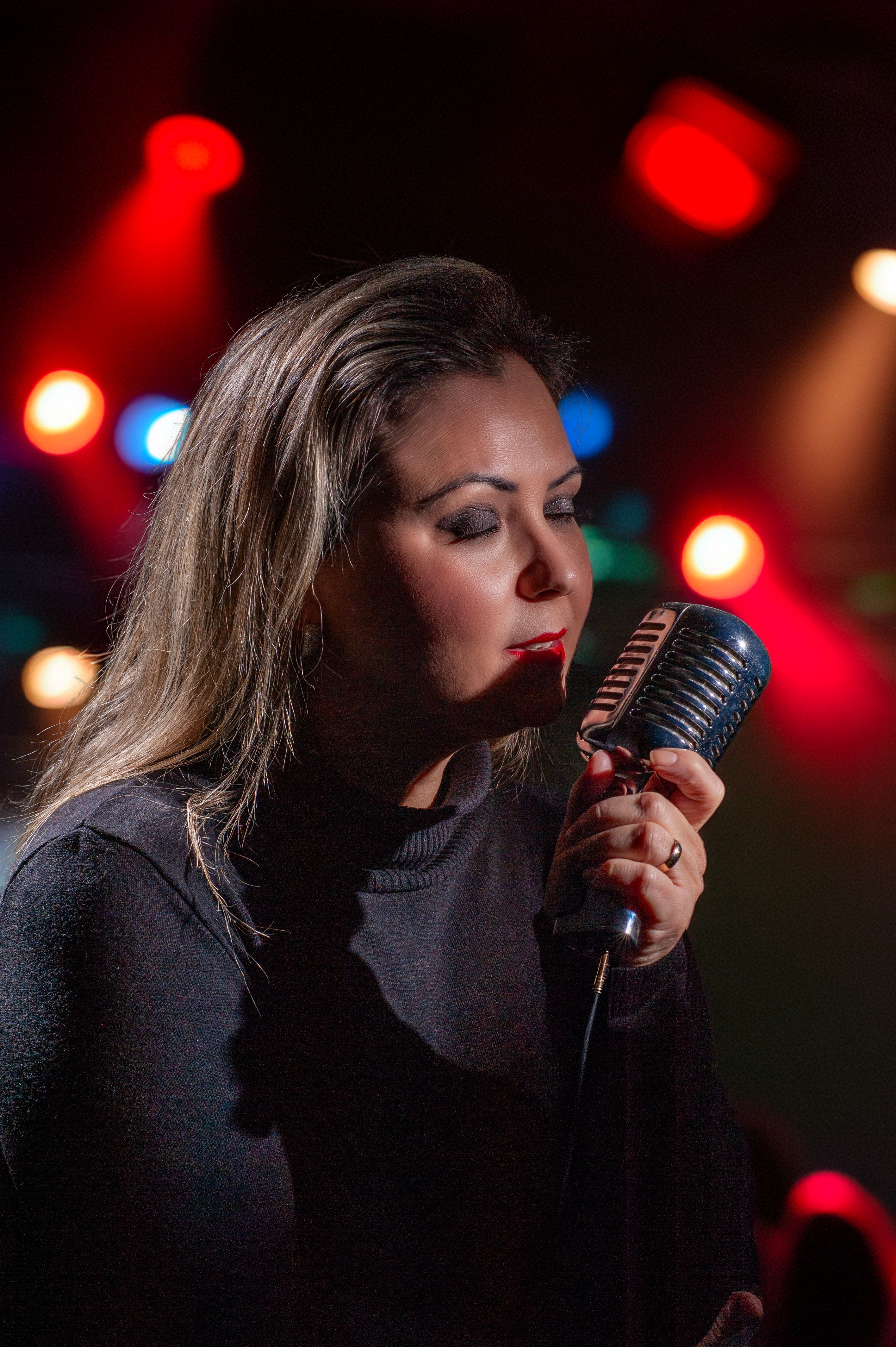 Woman Holding Microphone · Free Stock Photo