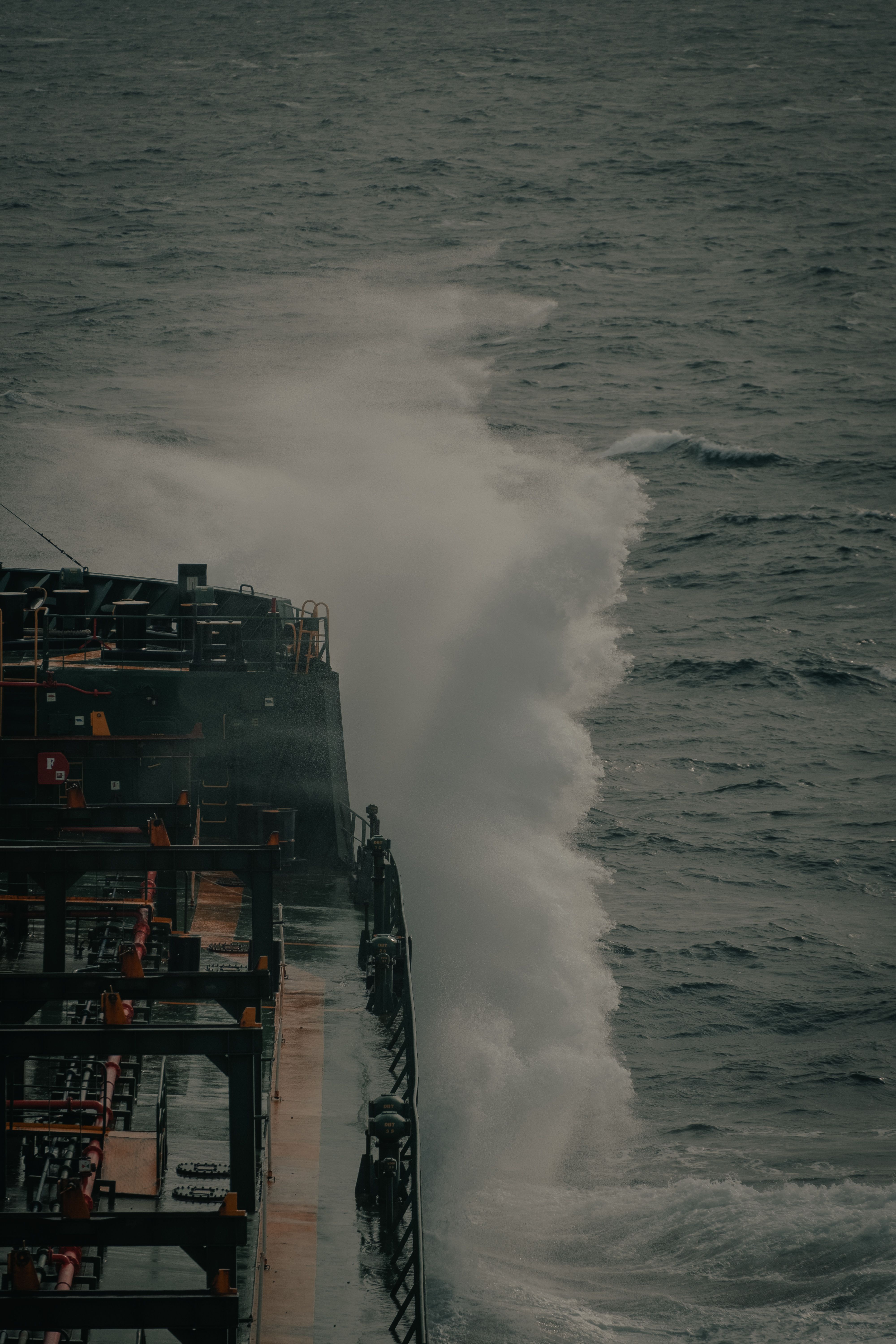 Dramatic Ocean Waves Against a Ship's Bow · Free Stock Photo