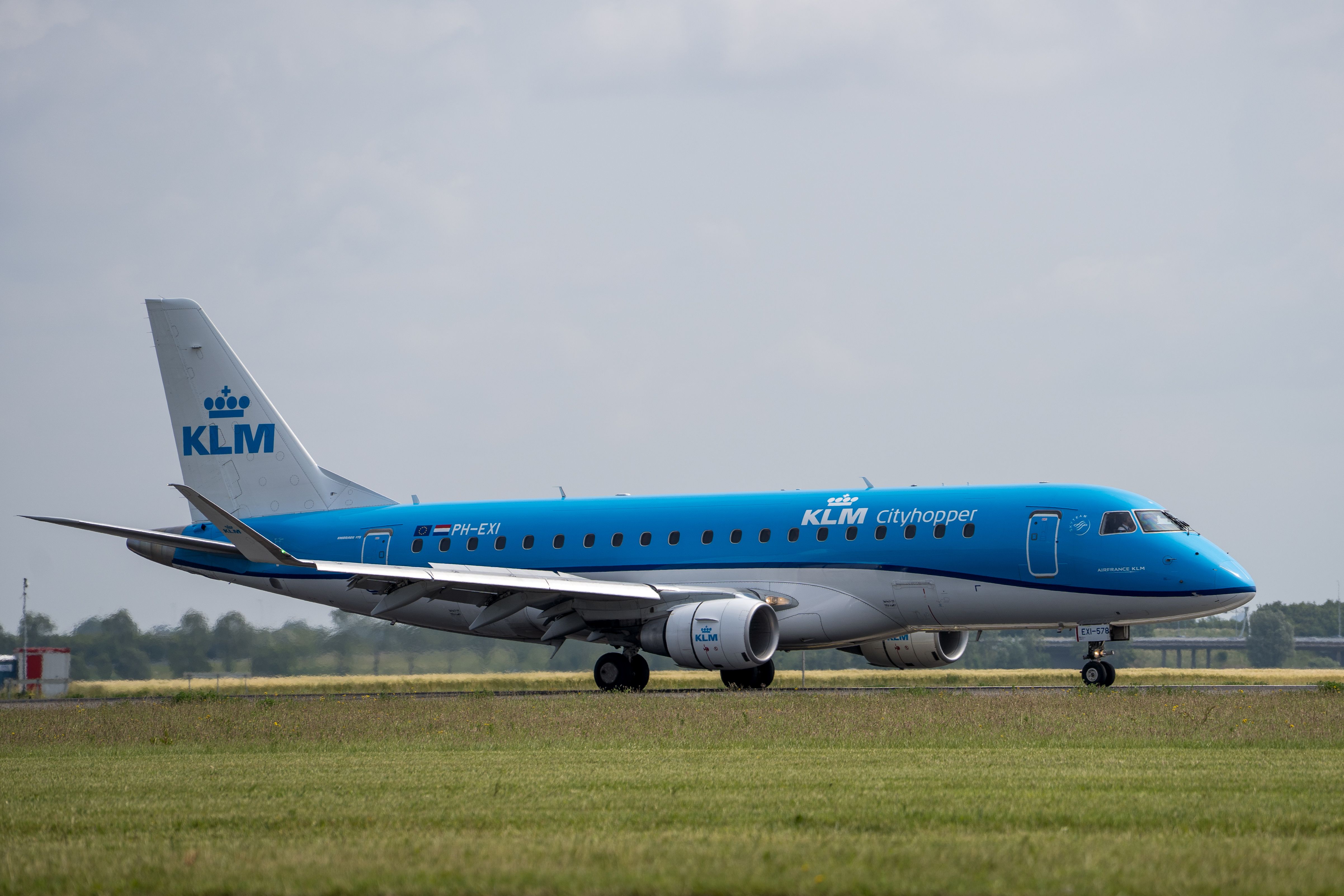 KLM Cityhopper Embraer 190 Aircraft on Runway · Free Stock Photo