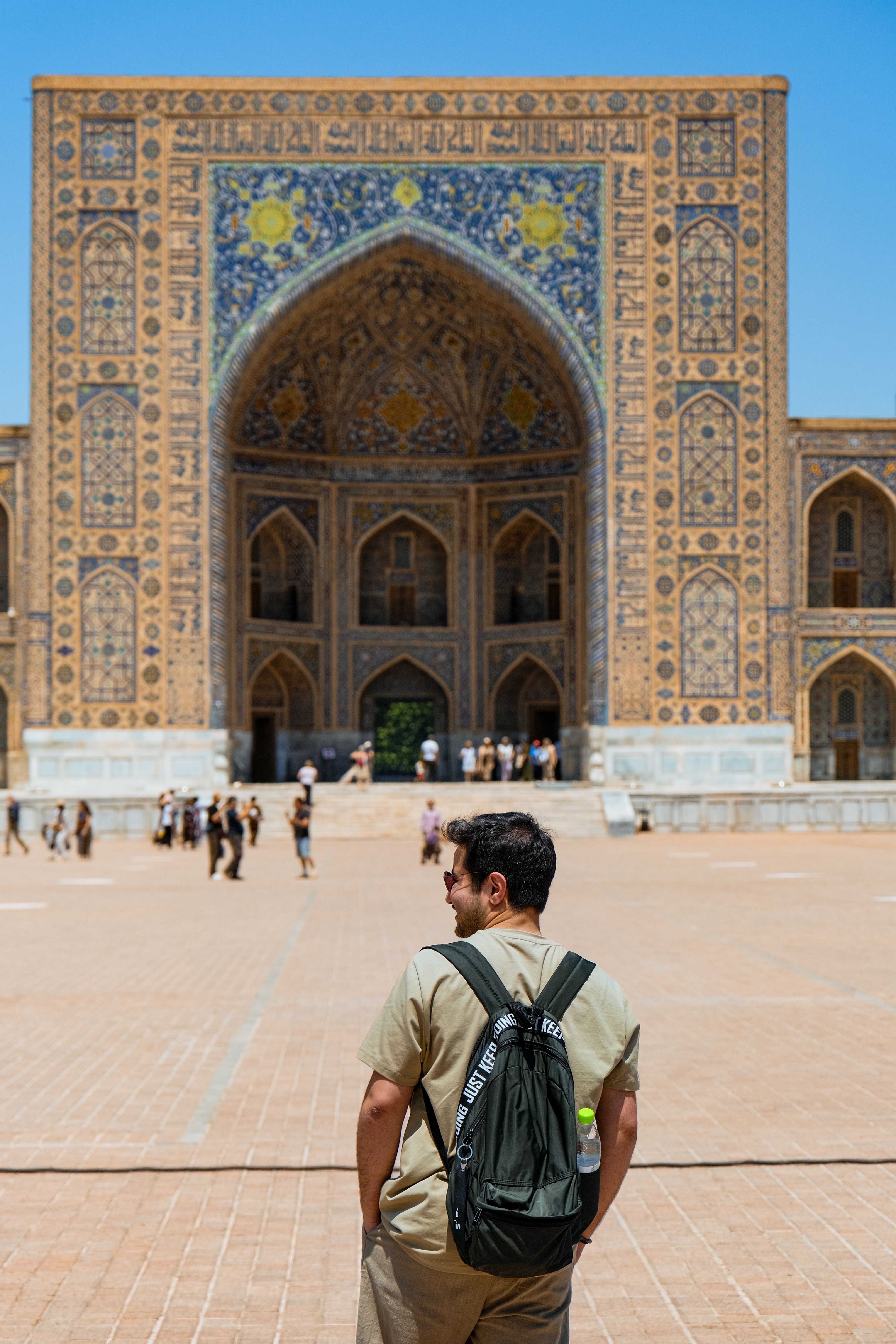 Traveler Exploring Historical Registan Complex · Free Stock Photo