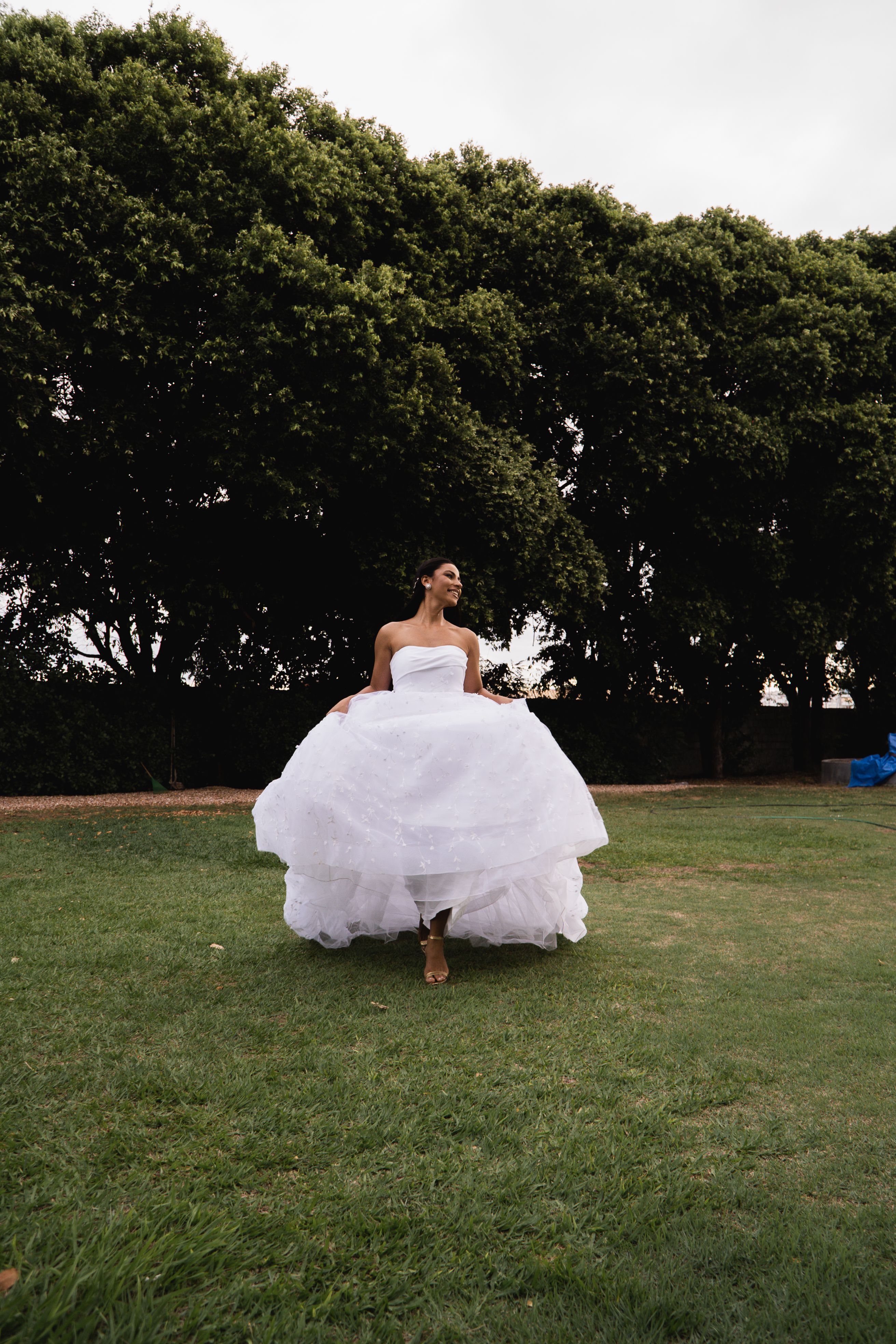 Bride in Elegant White Gown Outdoors · Free Stock Photo