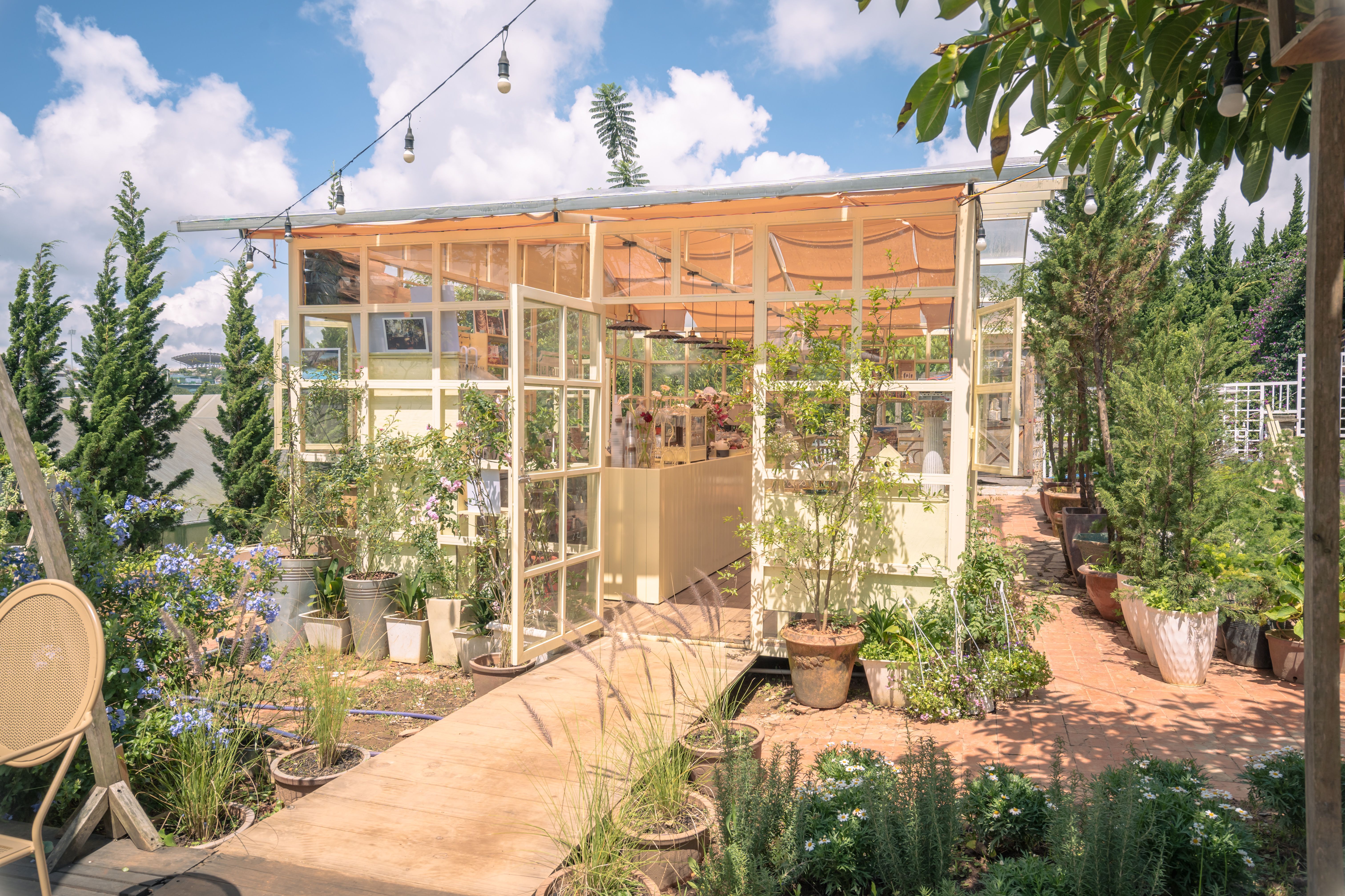Charming Outdoor Greenhouse in Sunny Garden · Free Stock Photo