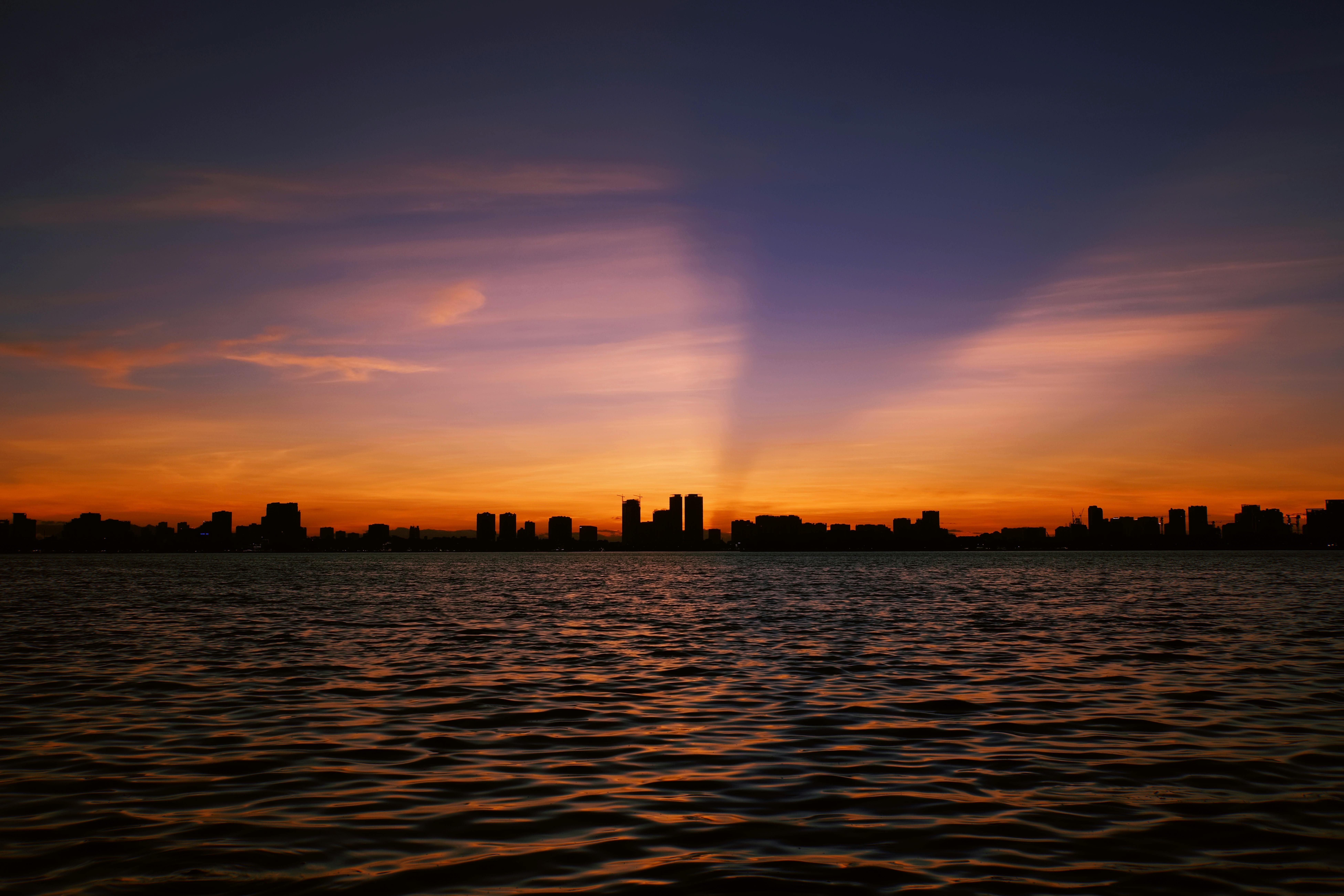 Stunning Sunset Over Hanoi Skyline Reflection · Free Stock Photo