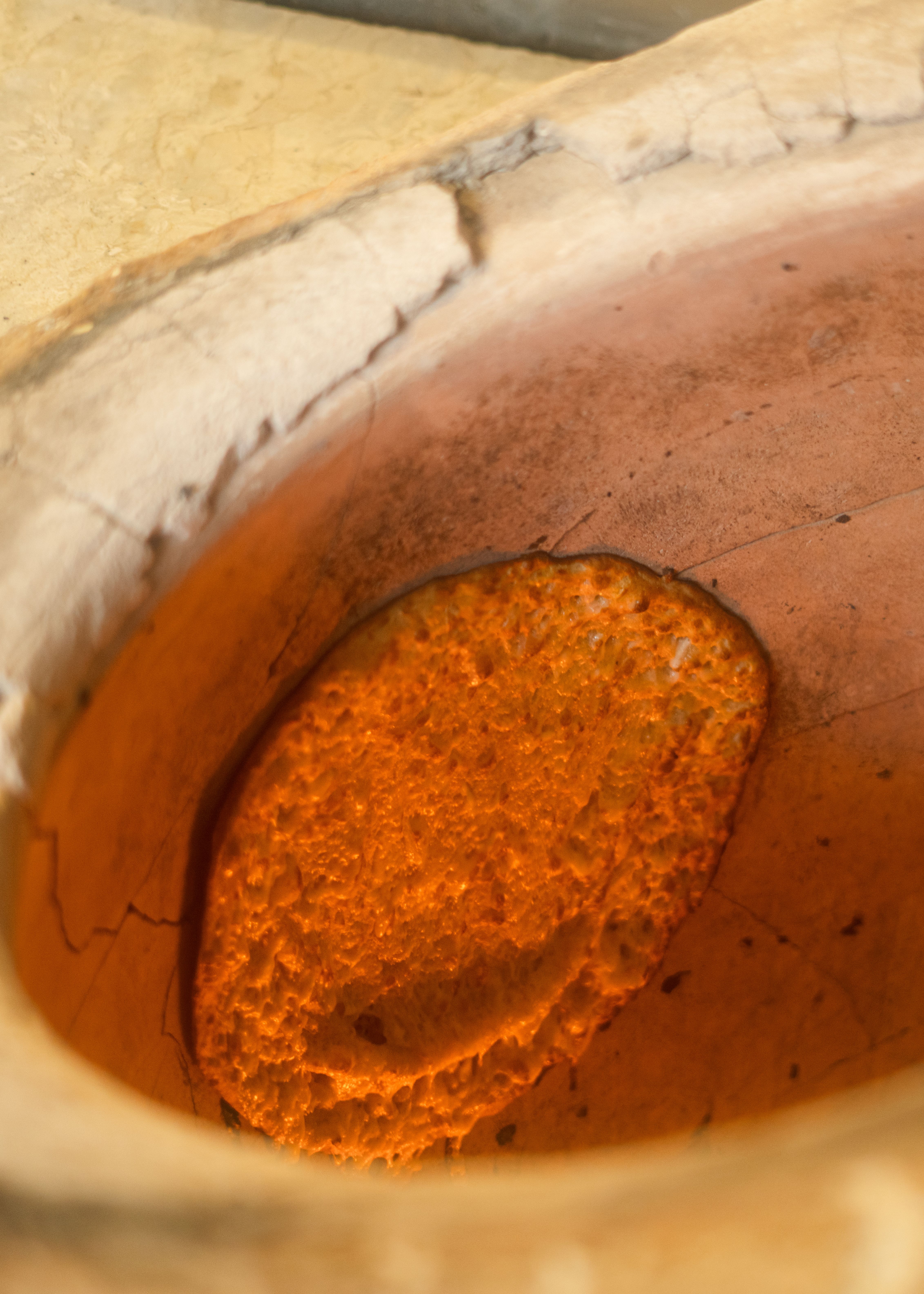Golden Bread Baking in a Traditional Tandoor Oven · Free Stock Photo