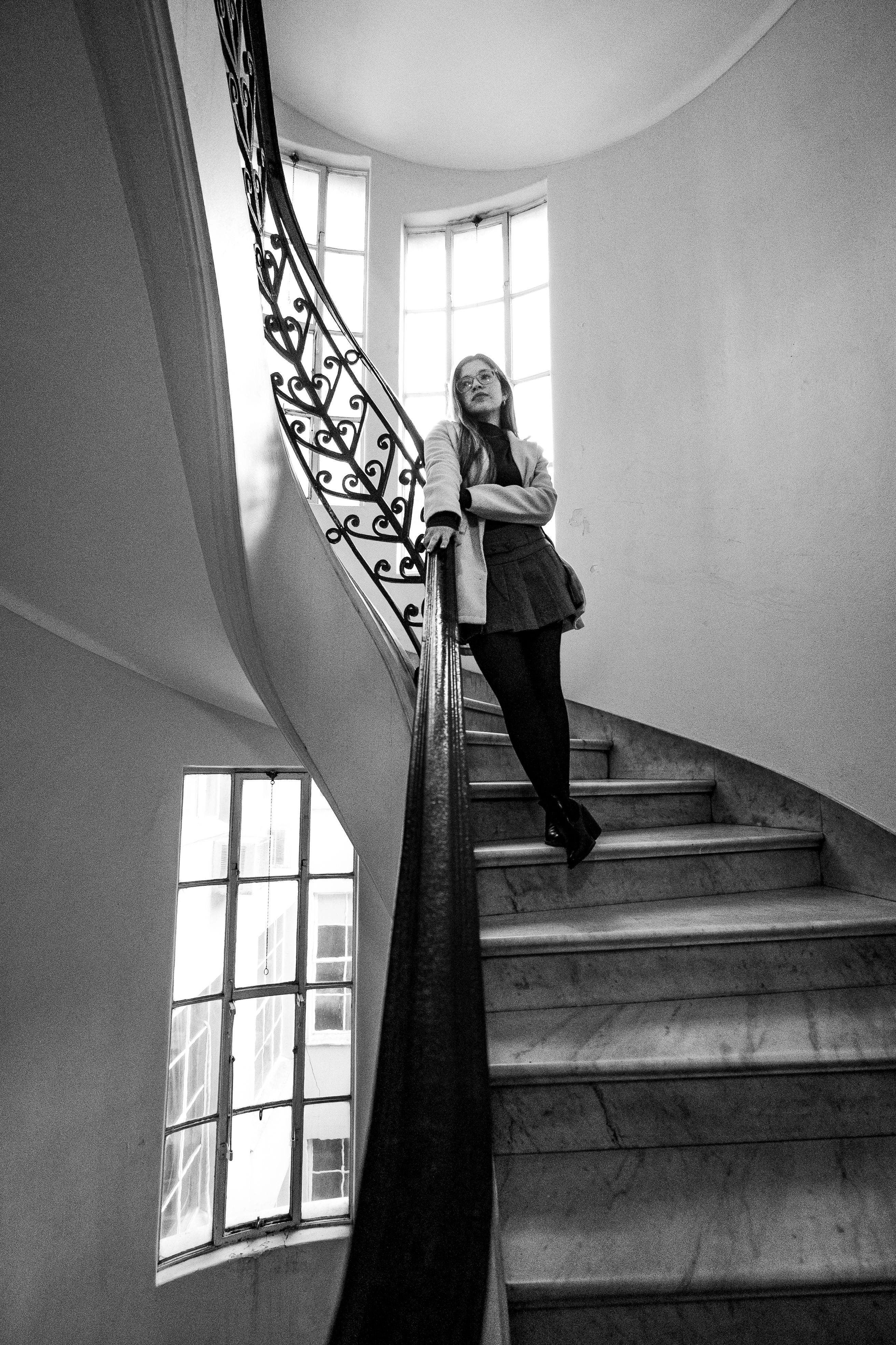 Black and White Portrait on Spiral Staircase · Free Stock Photo