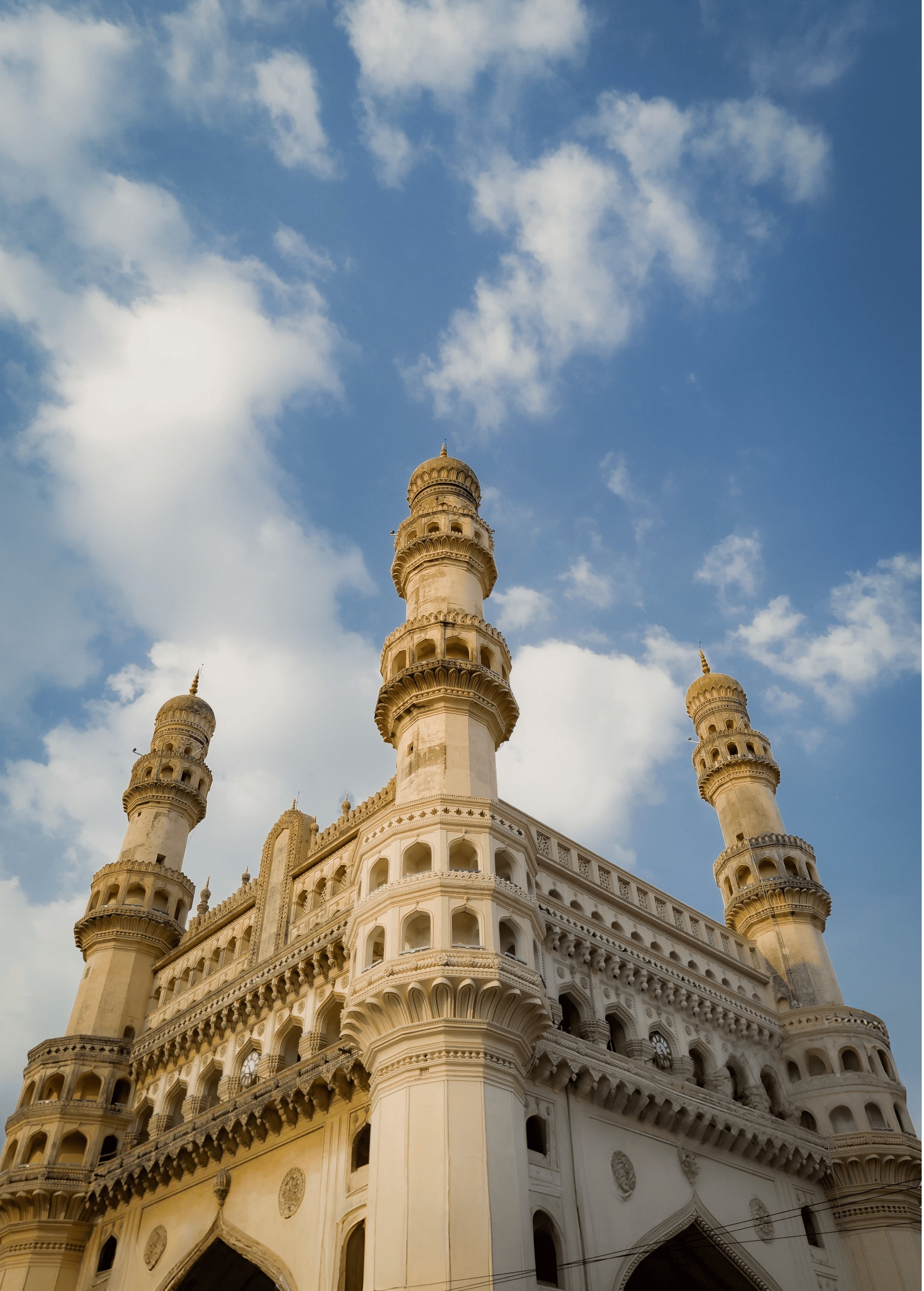 Majestic Charminar Against a Sunny Blue Sky · Free Stock Photo