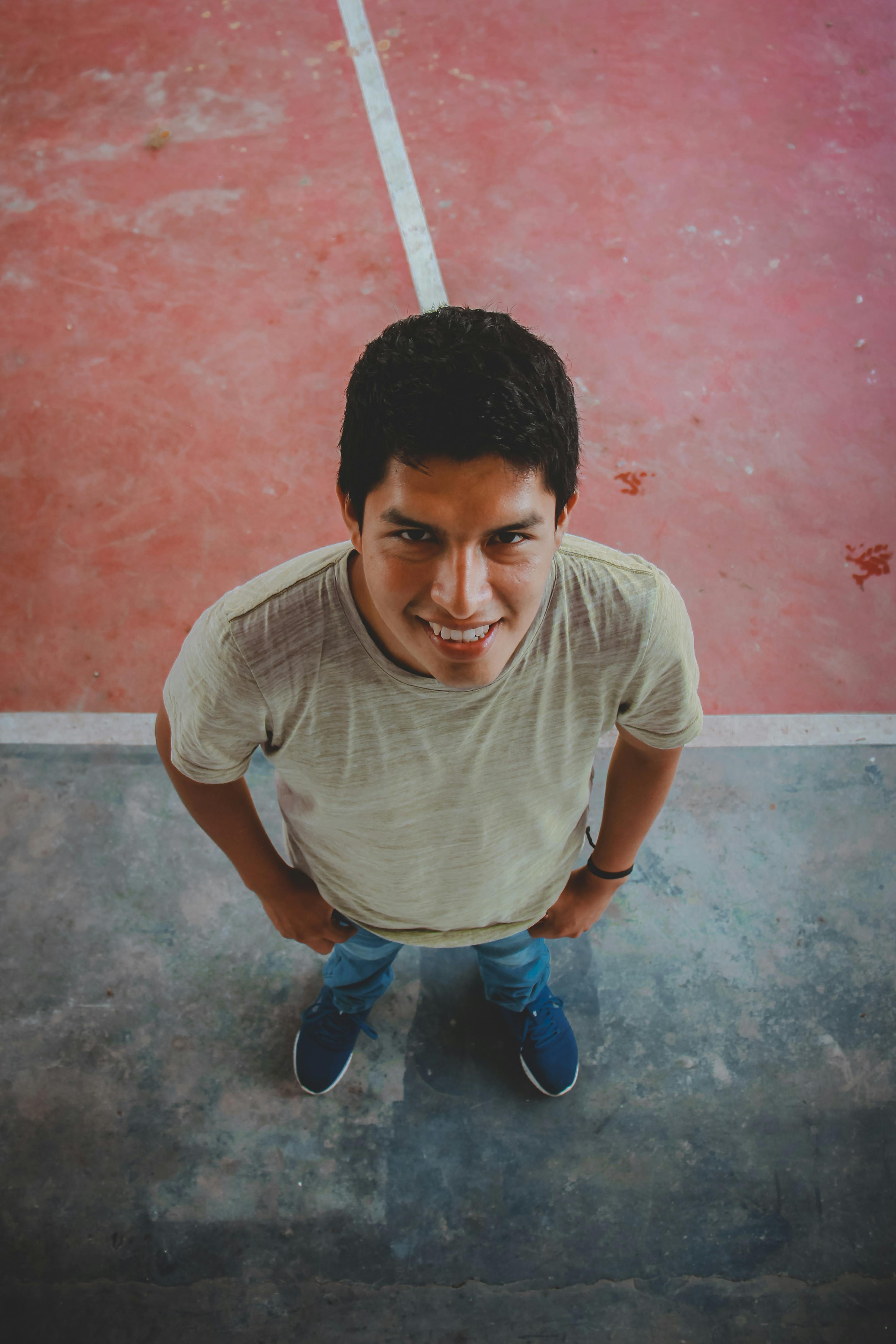 Man Standing on Concrete Pavement · Free Stock Photo
