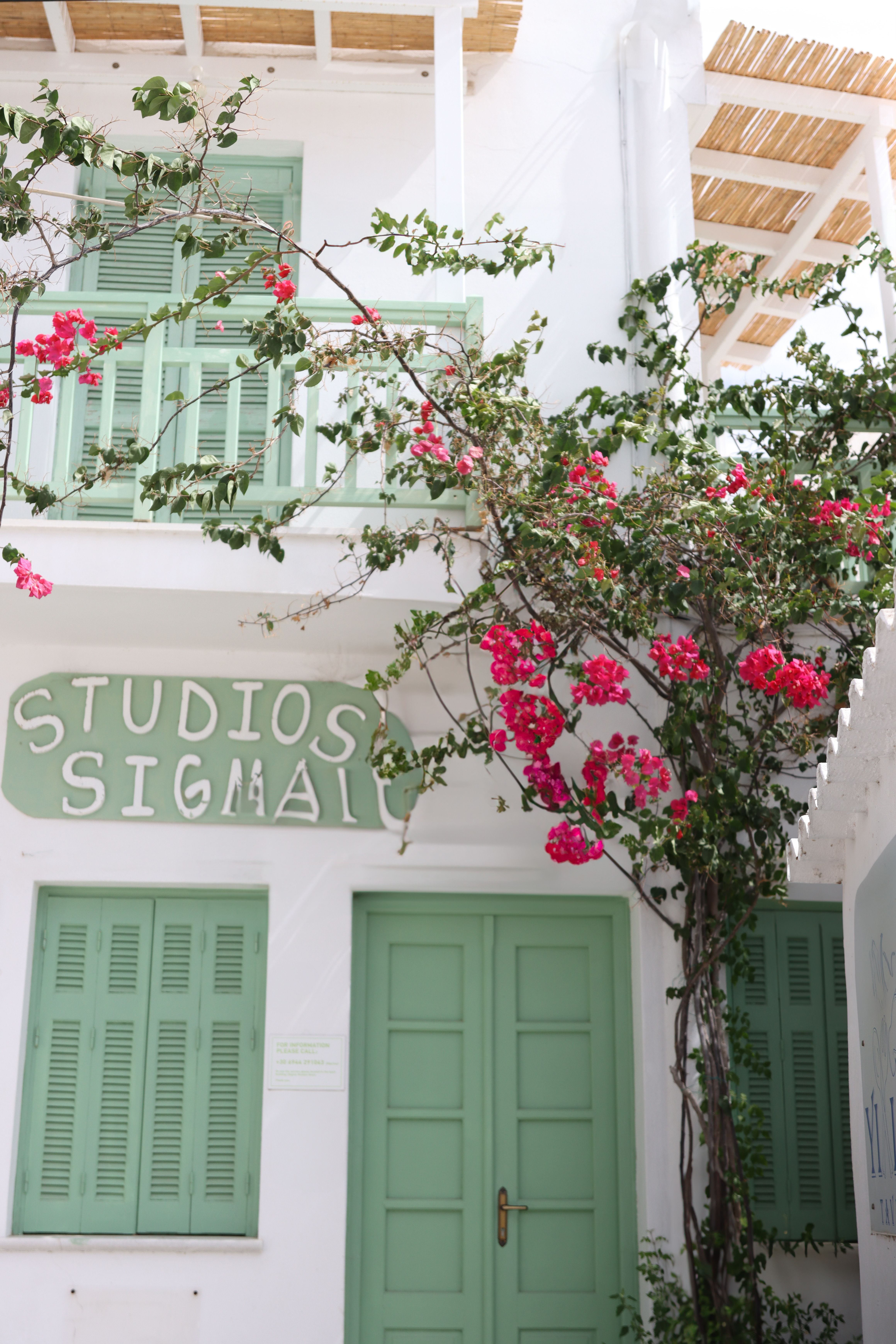 Charming Greek Architecture with Bougainvillea · Free Stock Photo