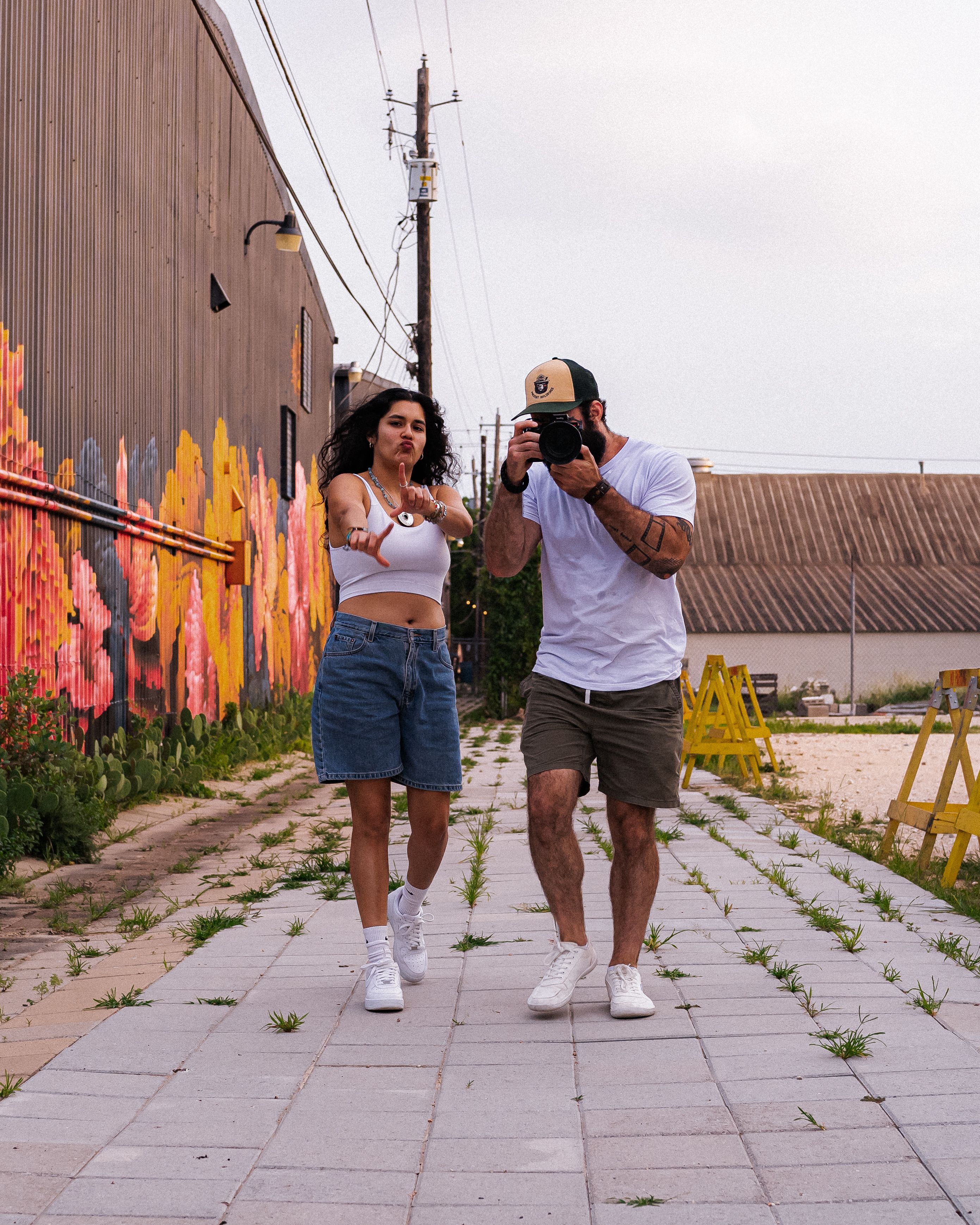 Street Photography Session with Vibrant Mural Backdrop · Free Stock Photo