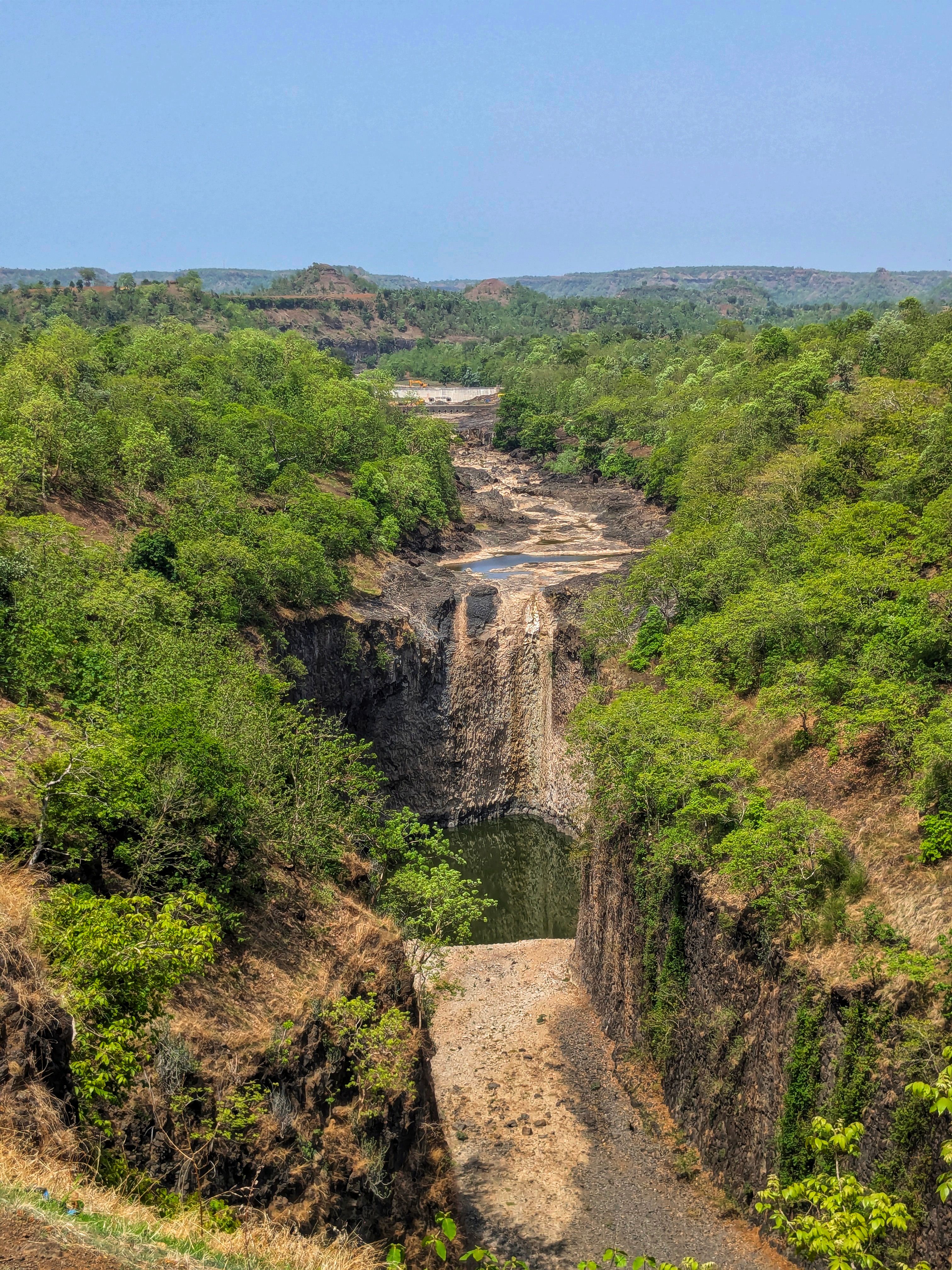 Scenic View of Gorge and Waterfall in Verdant Valley · Free Stock Photo
