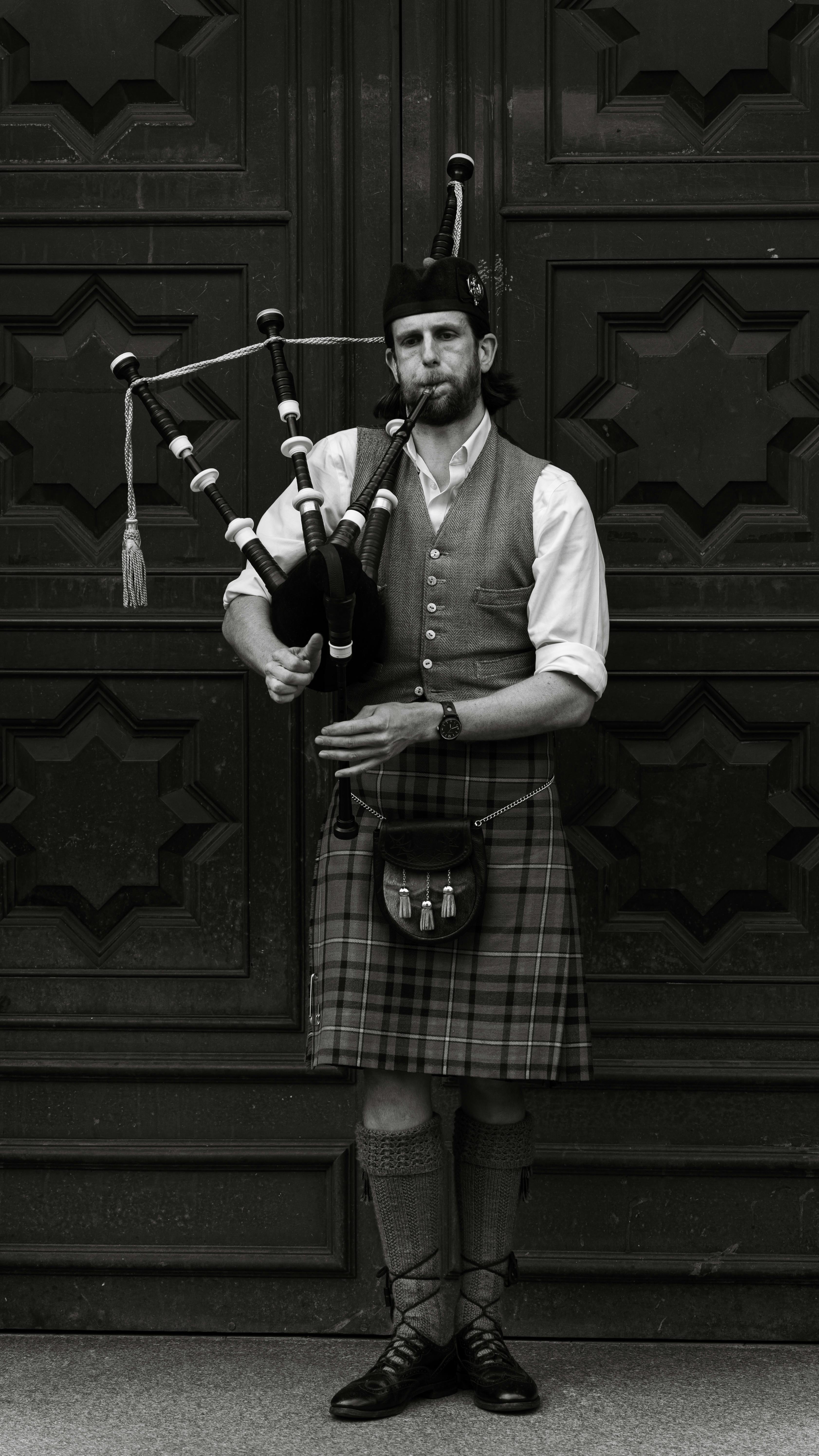 Scottish Bagpiper in Traditional Kilt · Free Stock Photo