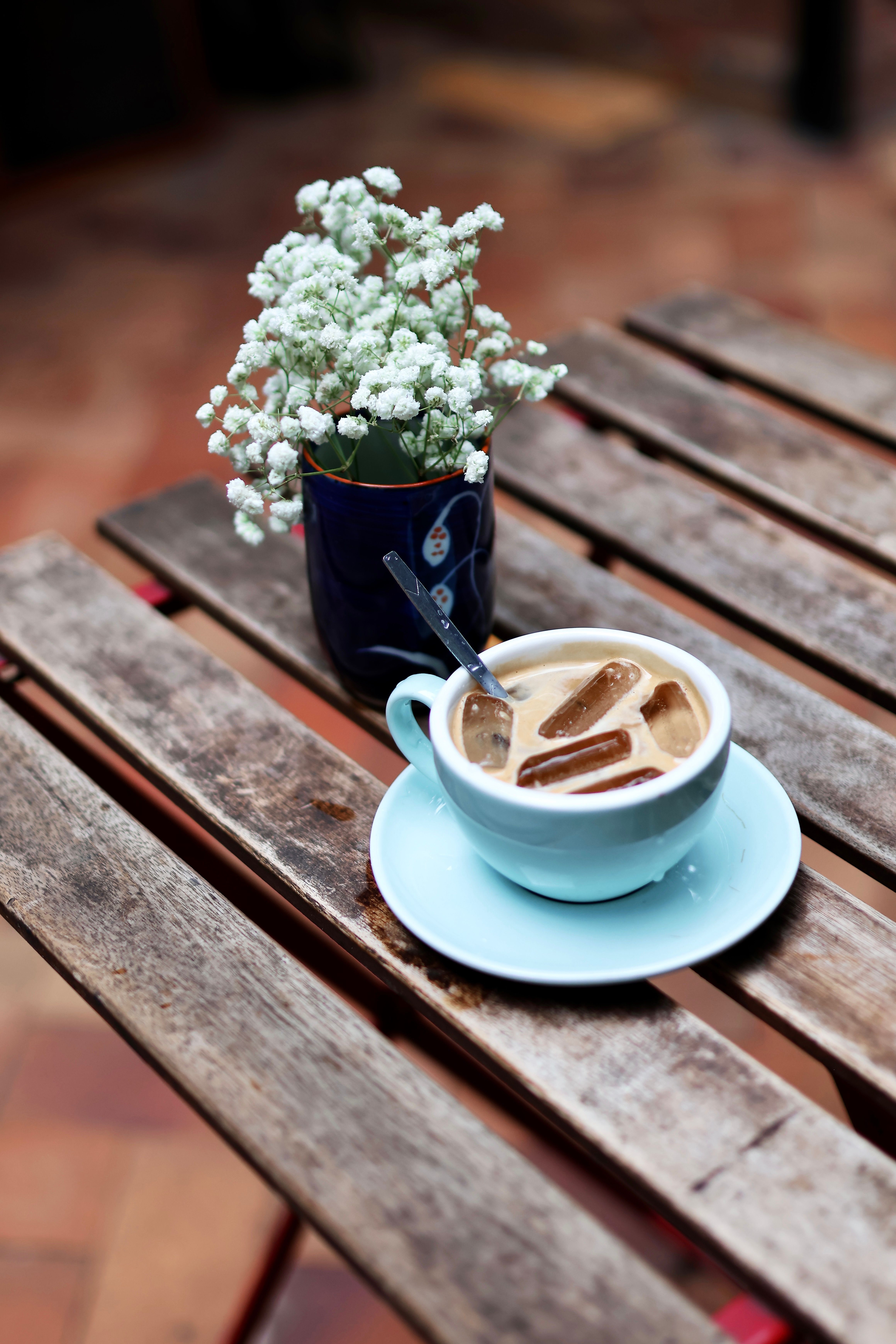 Chilled Coffee on Rustic Wooden Table with Flowers · Free Stock Photo