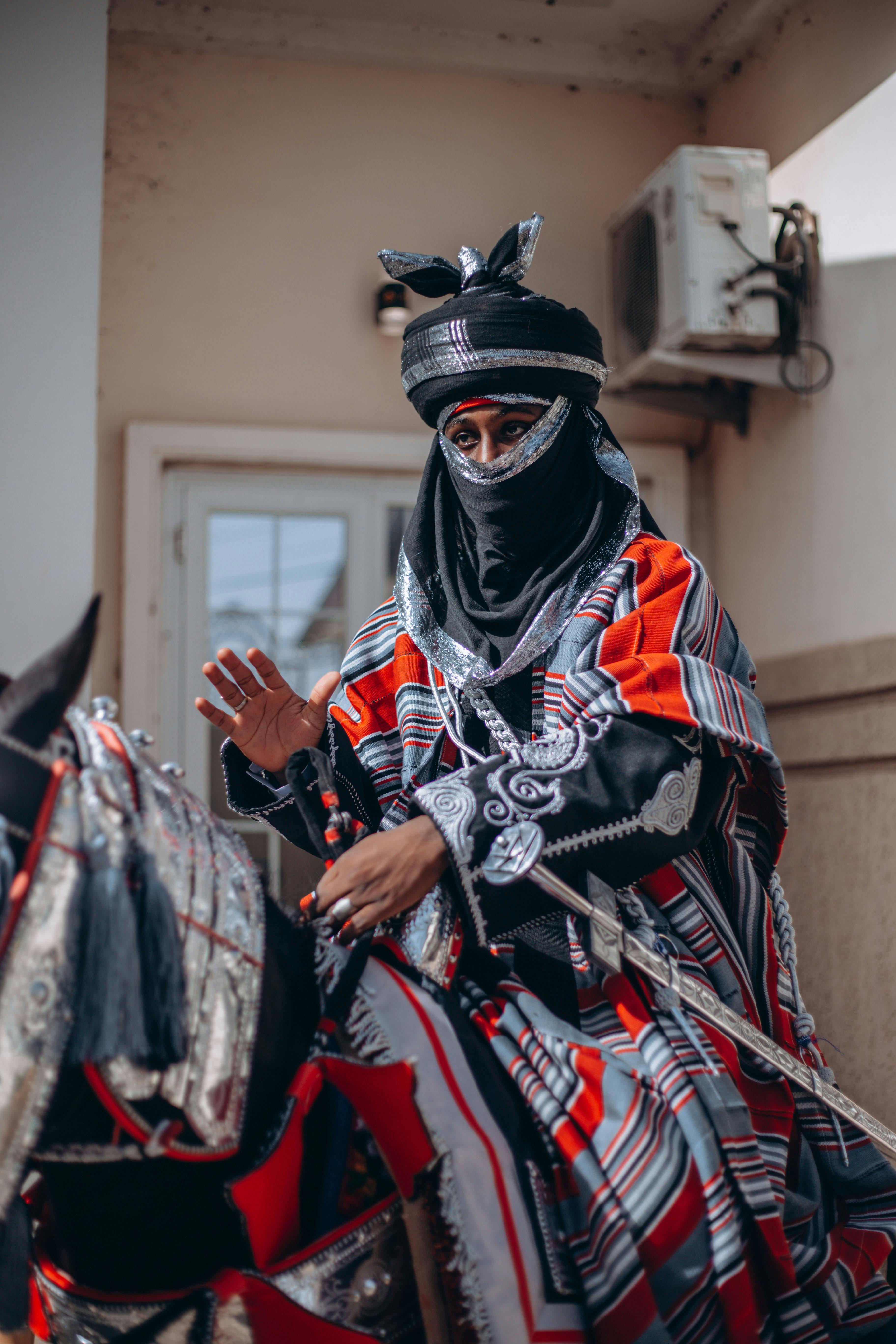 Traditional Nomadic Horseman in Colorful Attire · Free Stock Photo