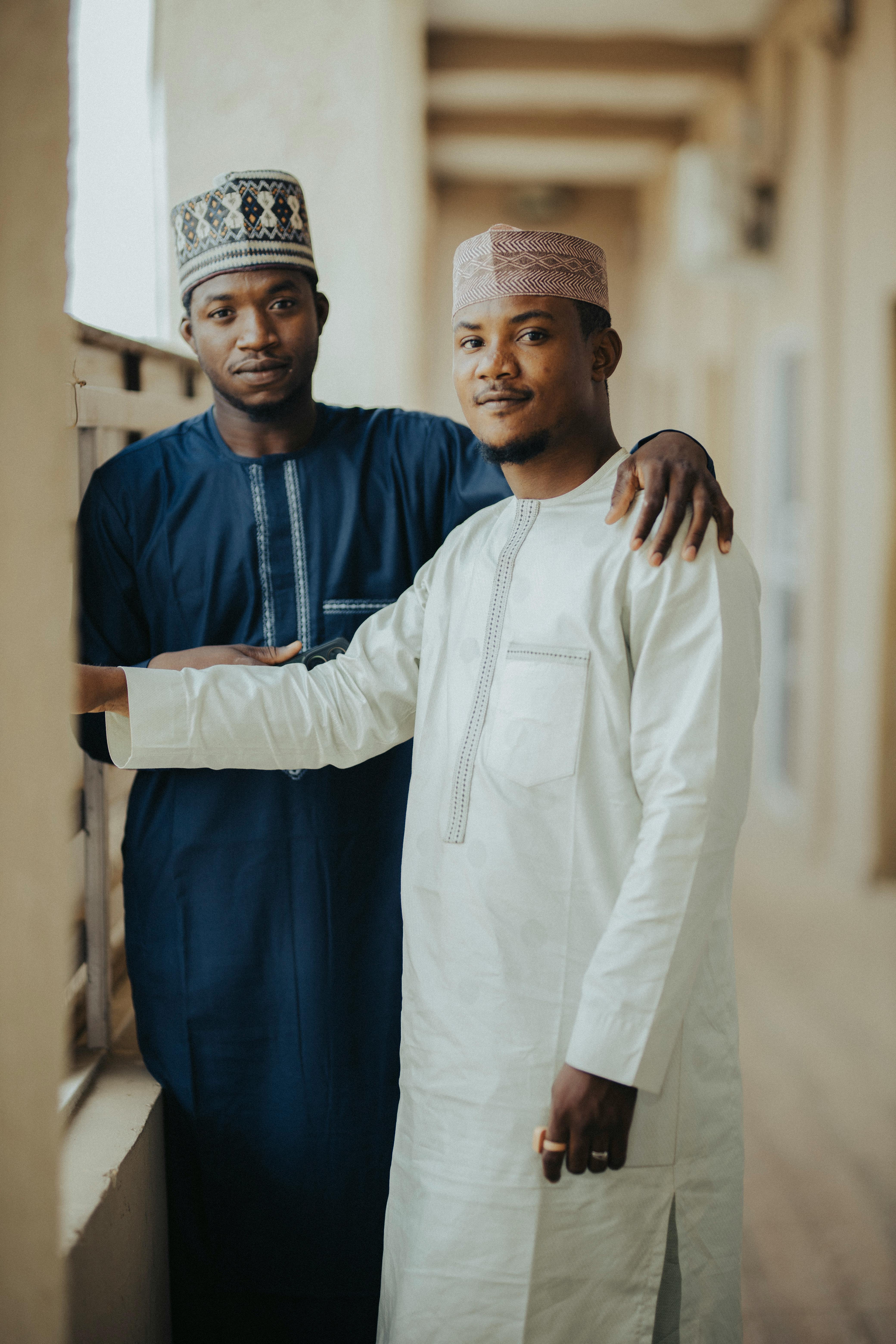 Two Men in Traditional African Attire Indoors · Free Stock Photo