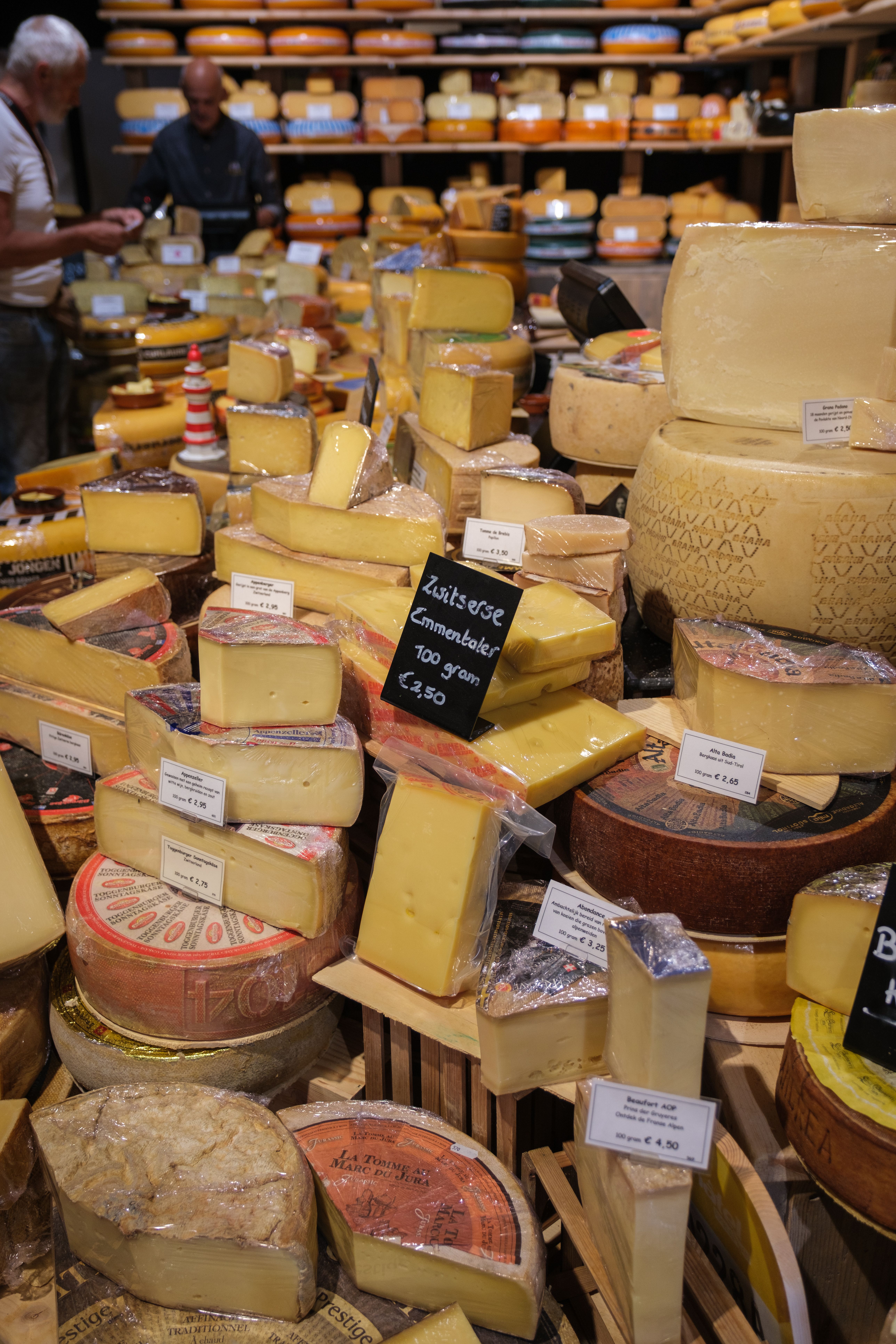 Variety of Cheeses Displayed in Cheese Shop · Free Stock Photo