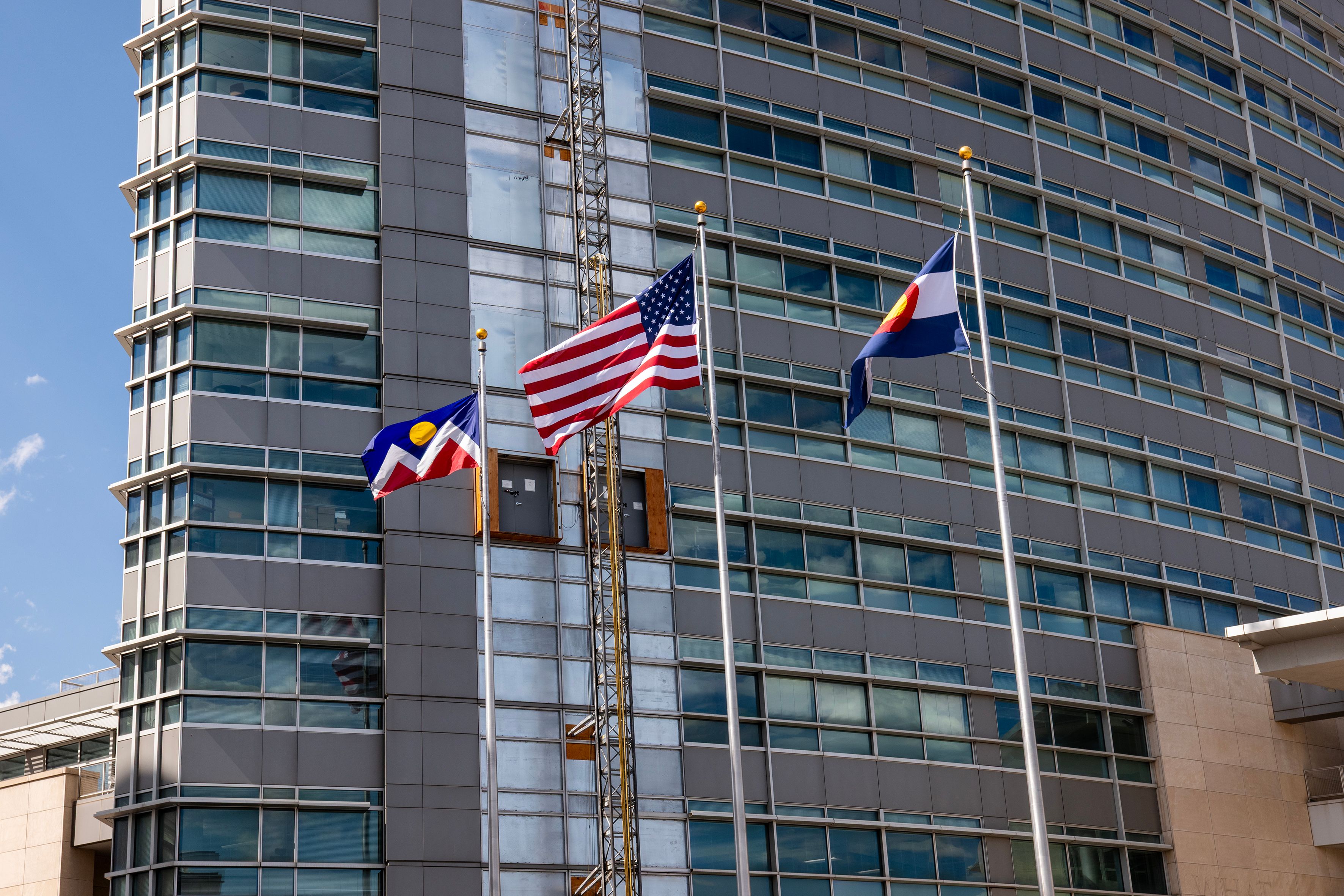 High-rise Building with American and Colorado Flags · Free Stock Photo