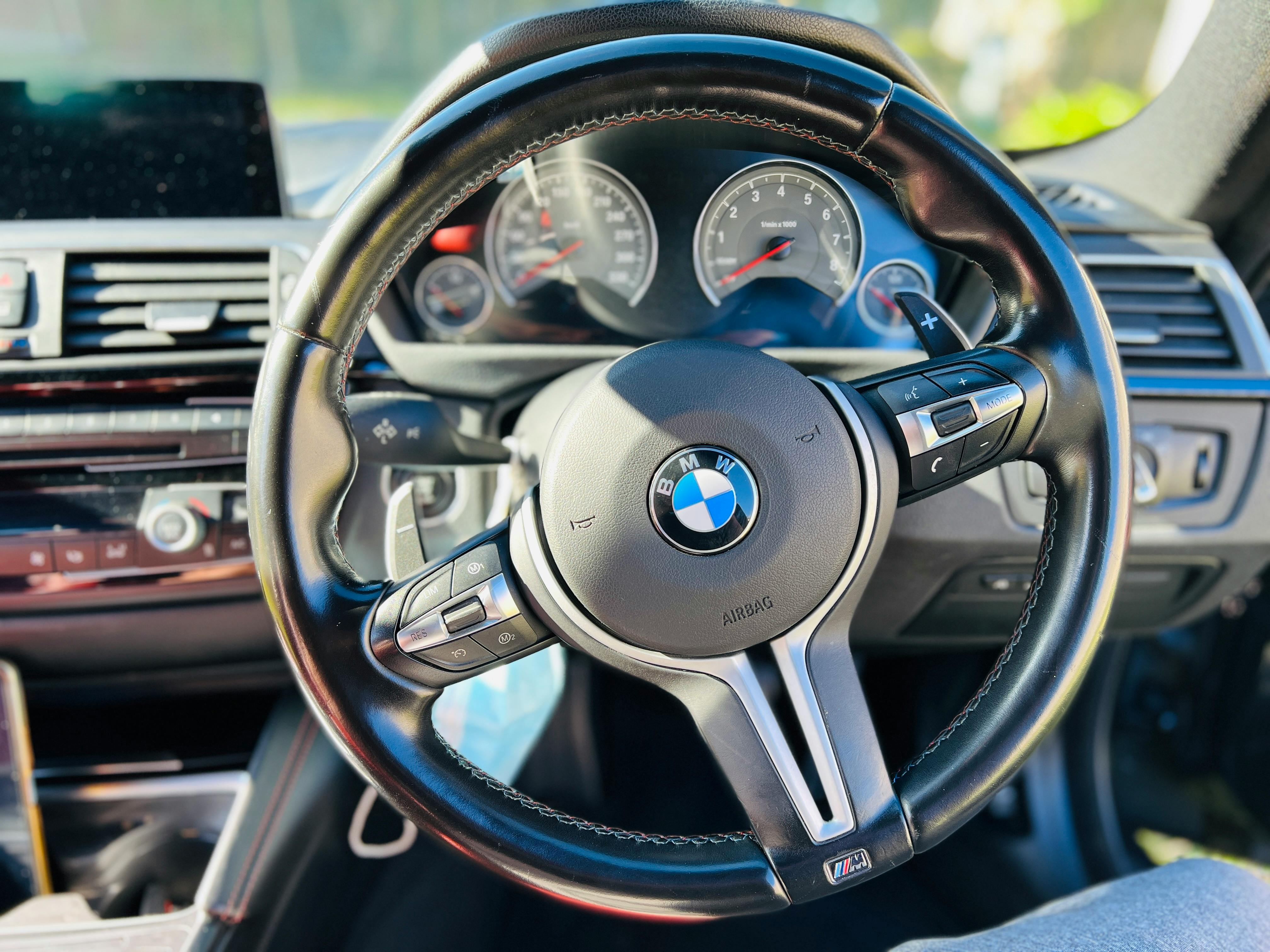 Luxury Car Interior with Steering Wheel Close-Up · Free Stock Photo