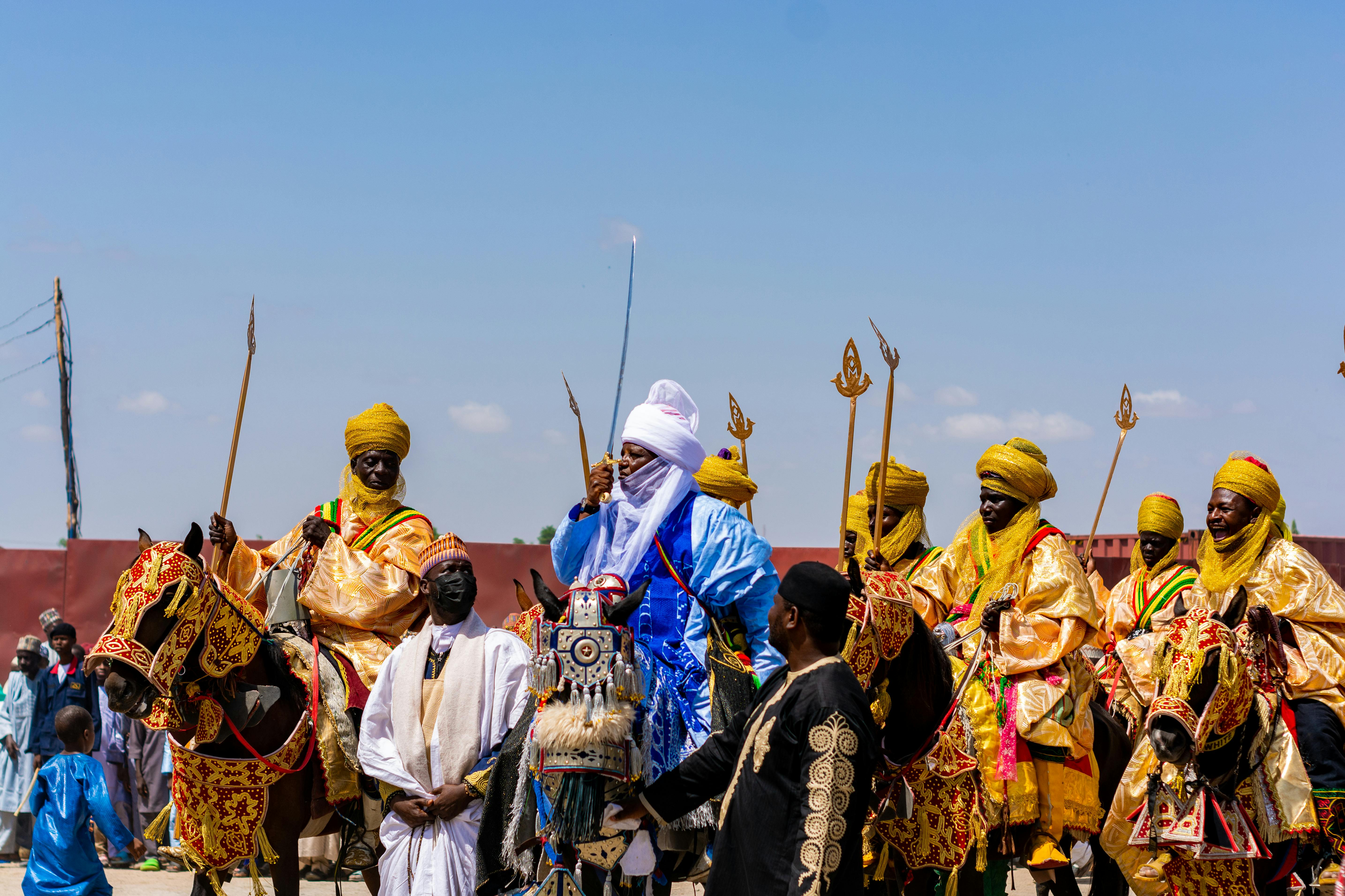 Traditional Cultural Parade with Colorful Attire · Free Stock Photo