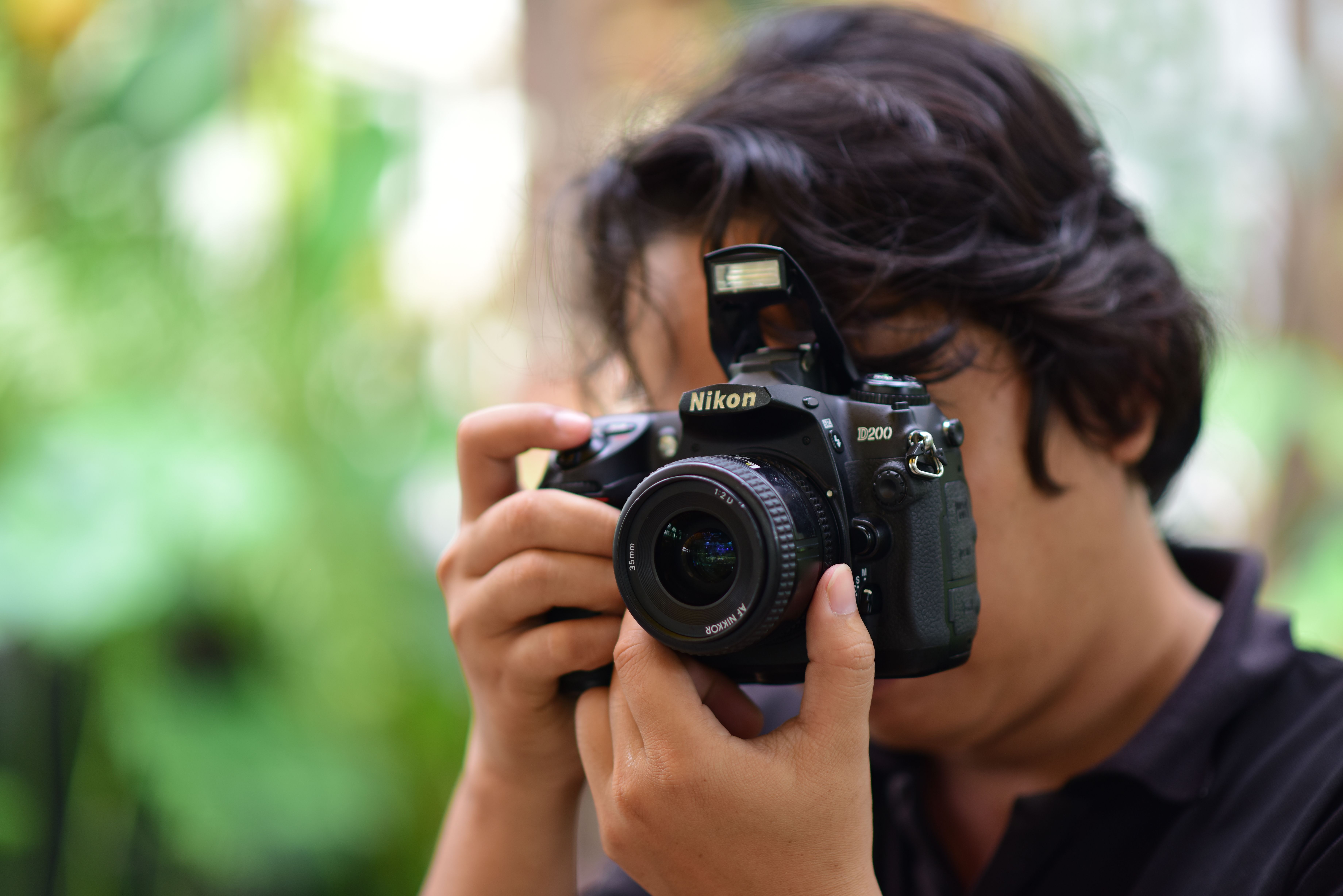Photographer Capturing with a DSLR Camera · Free Stock Photo