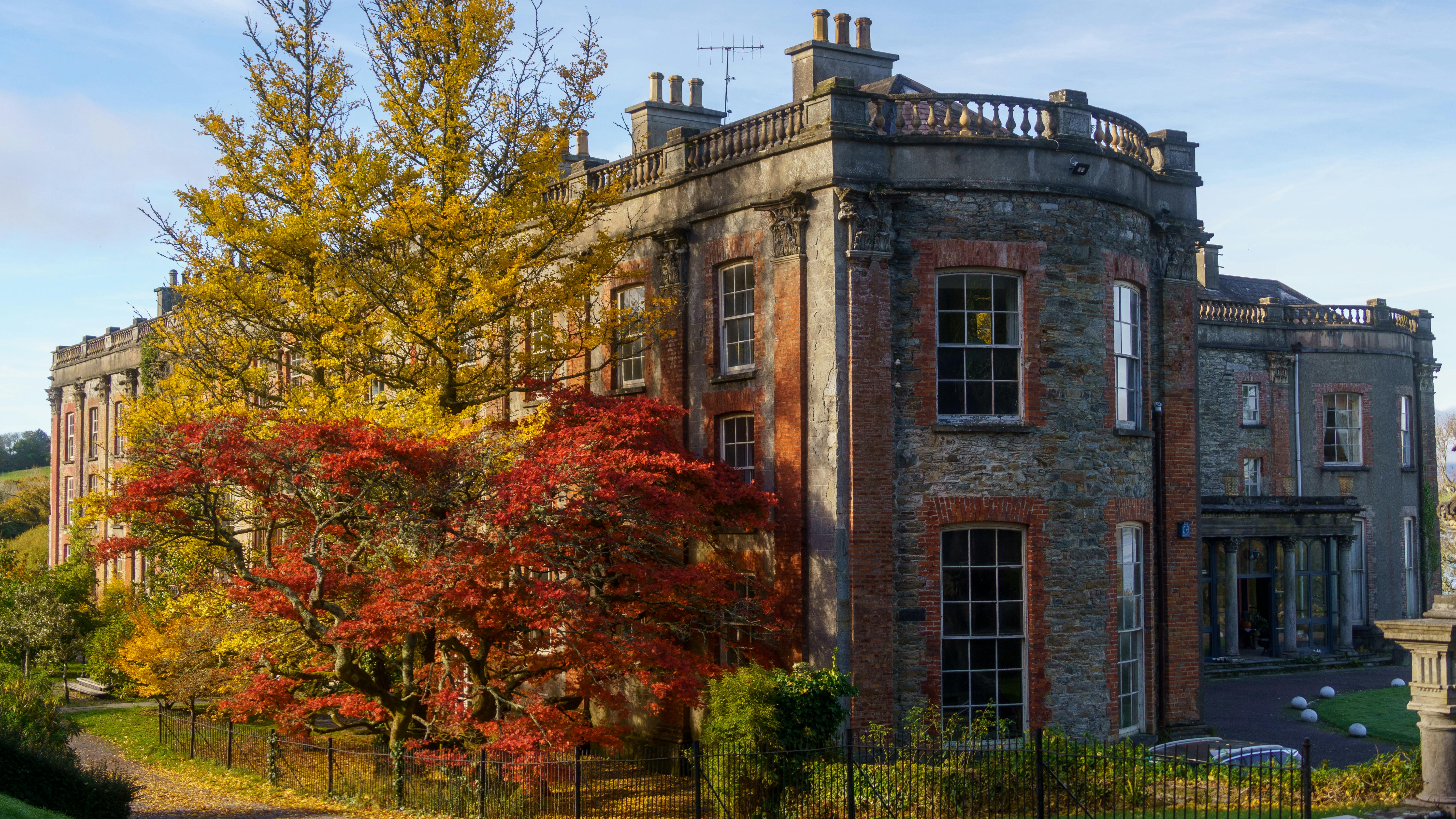 Historic Irish Mansion in Autumn Foliage · Free Stock Photo