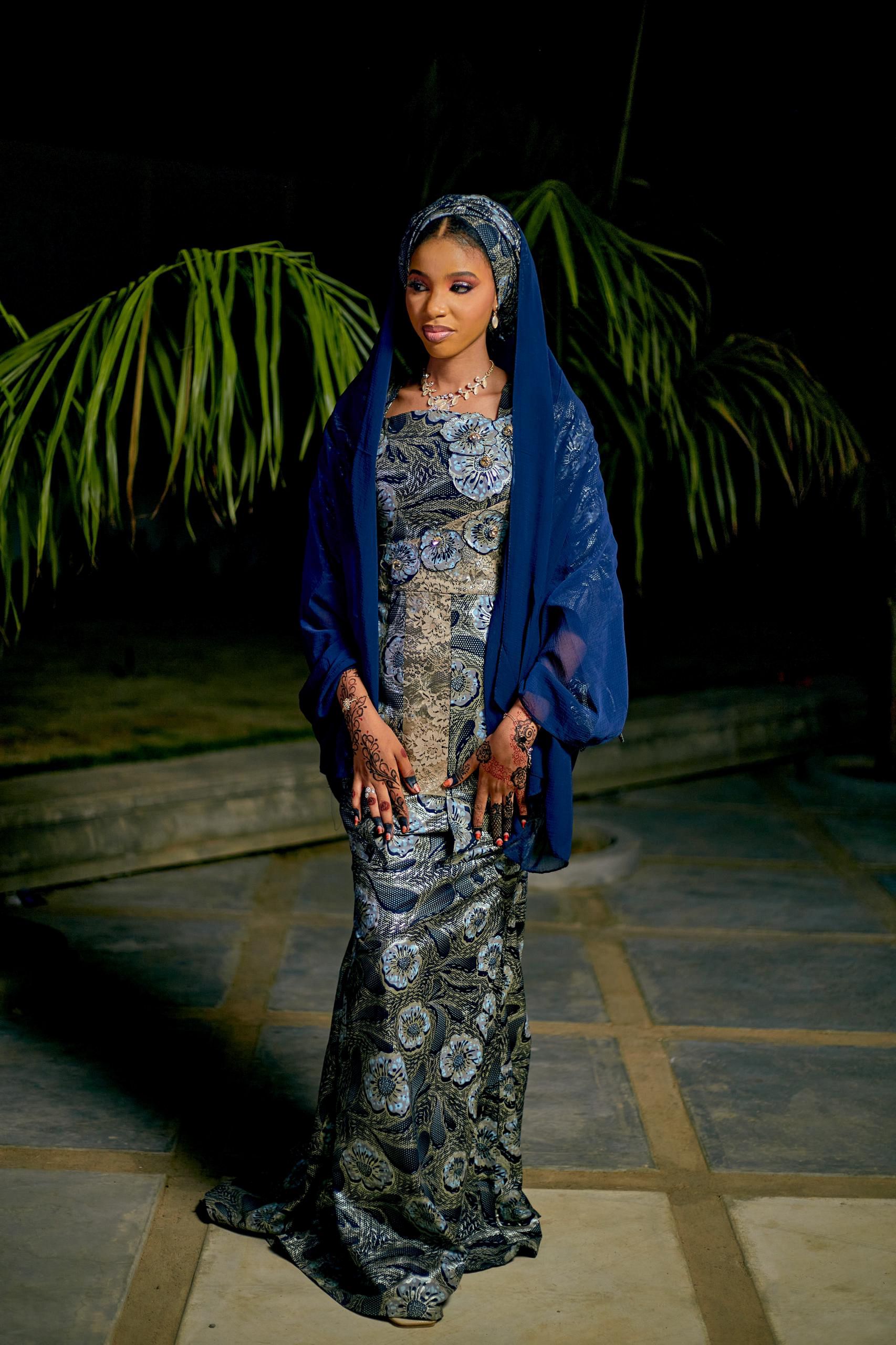 Elegant Woman in Traditional Blue Attire Outdoors · Free Stock Photo