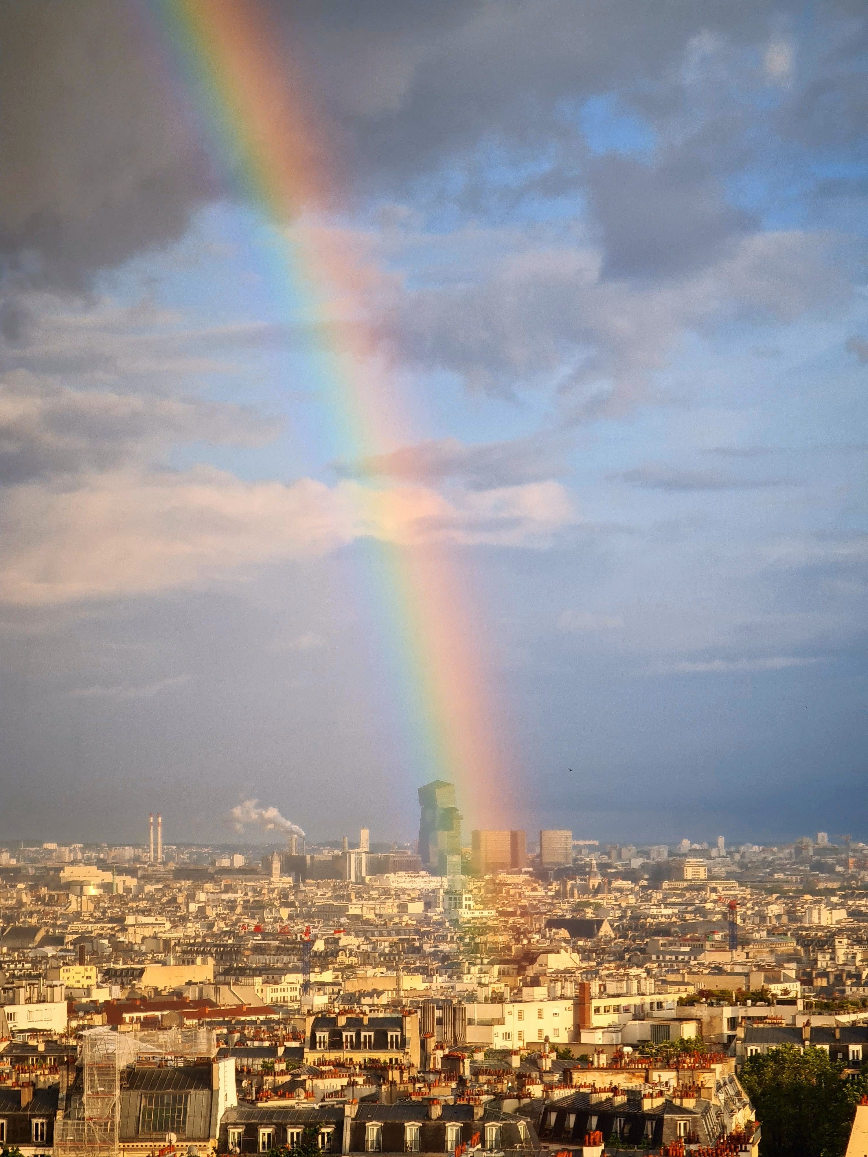 Vibrant Rainbow Over Paris Skyline · Free Stock Photo