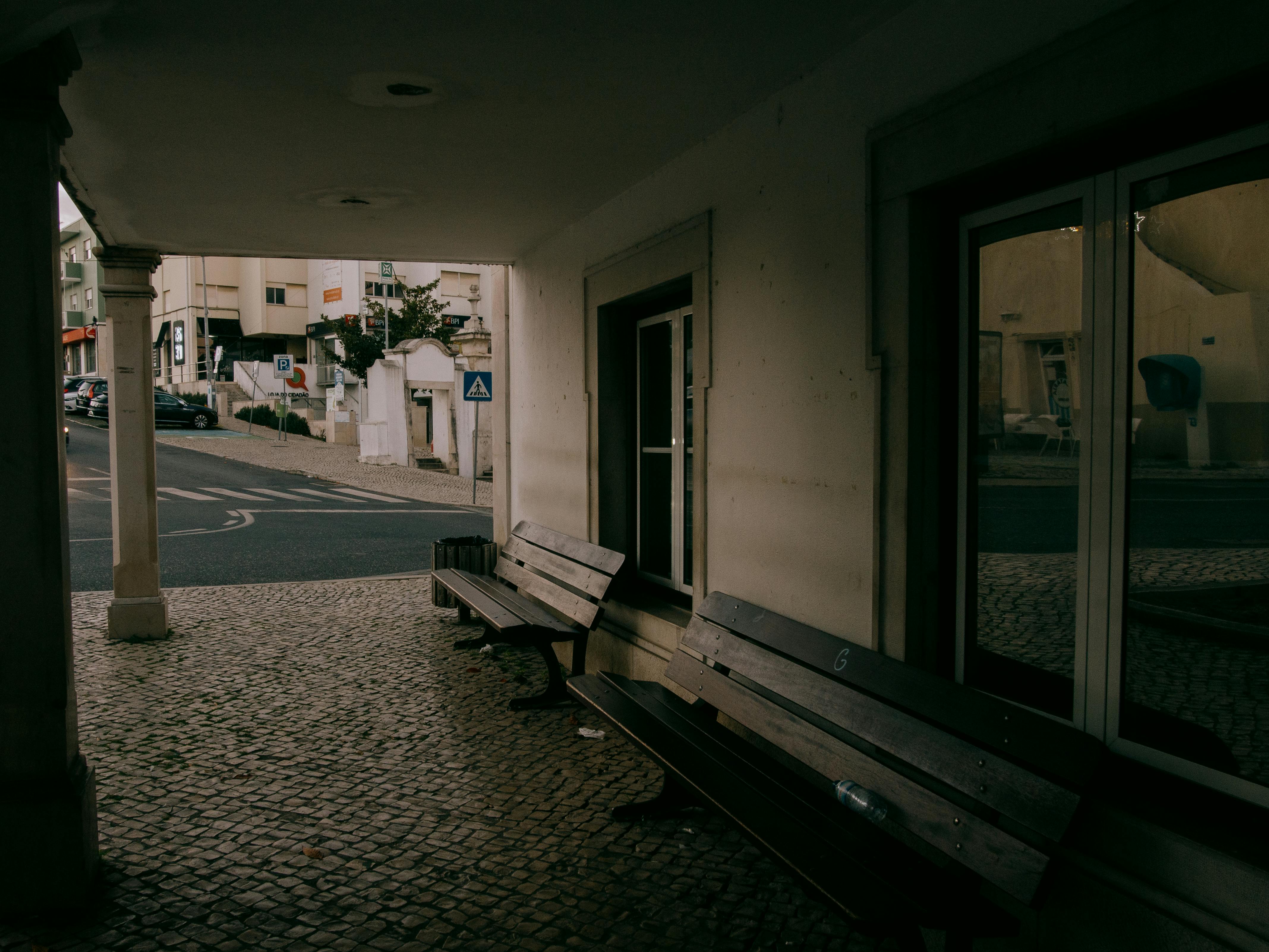 Shadowy Urban Street View with Benches · Free Stock Photo