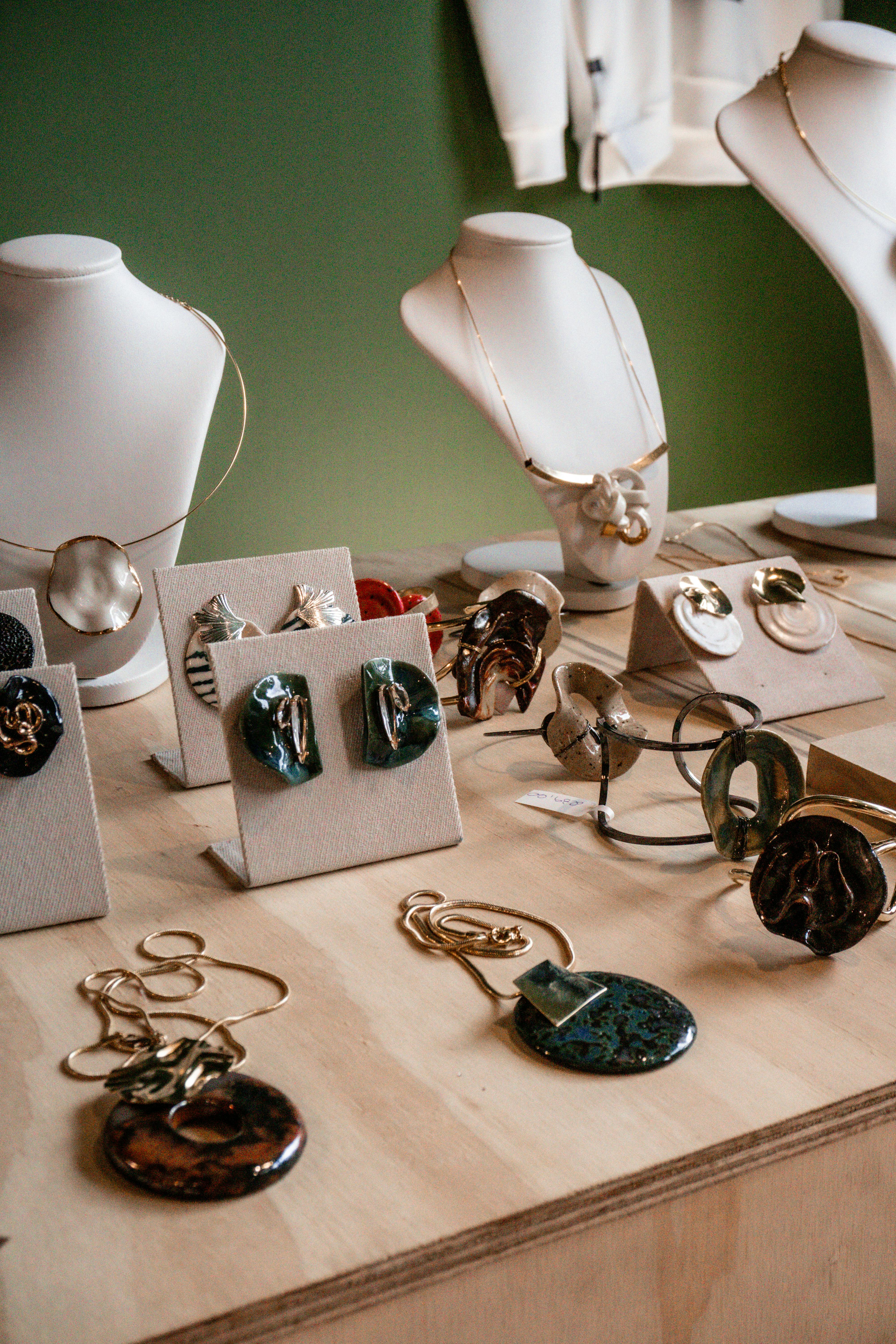 Elegant Jewelry Display on Wooden Counter · Free Stock Photo