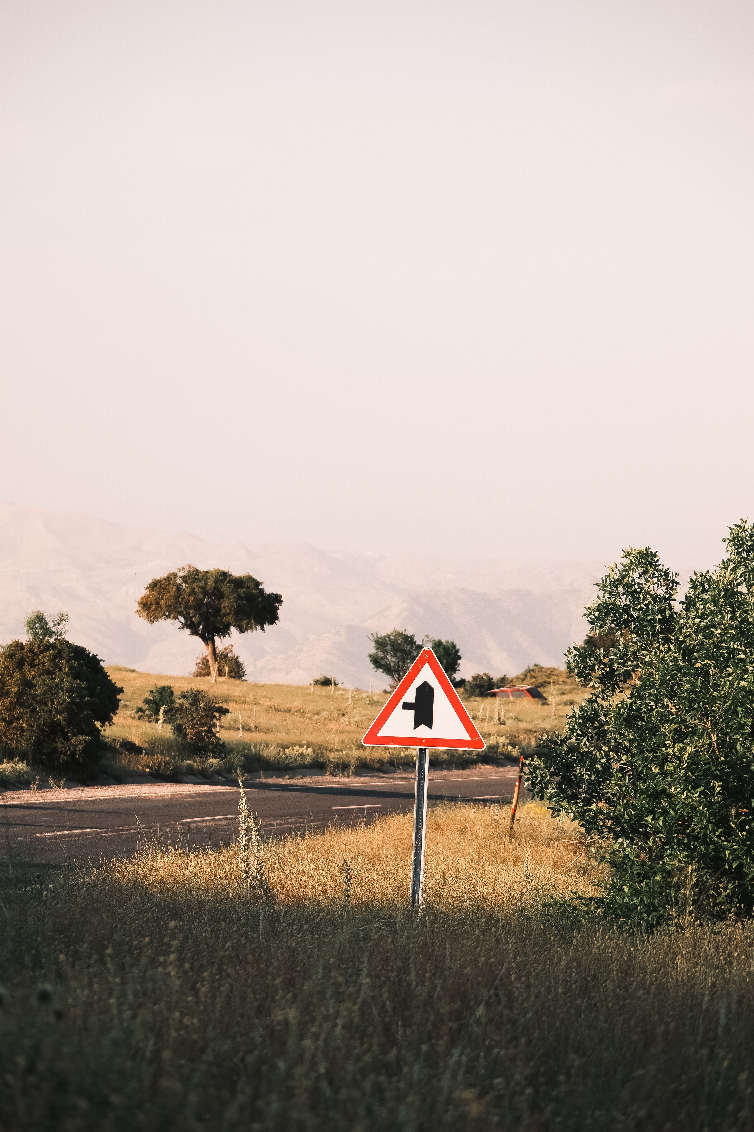 Scenic Road Scene with Warning Traffic Sign · Free Stock Photo