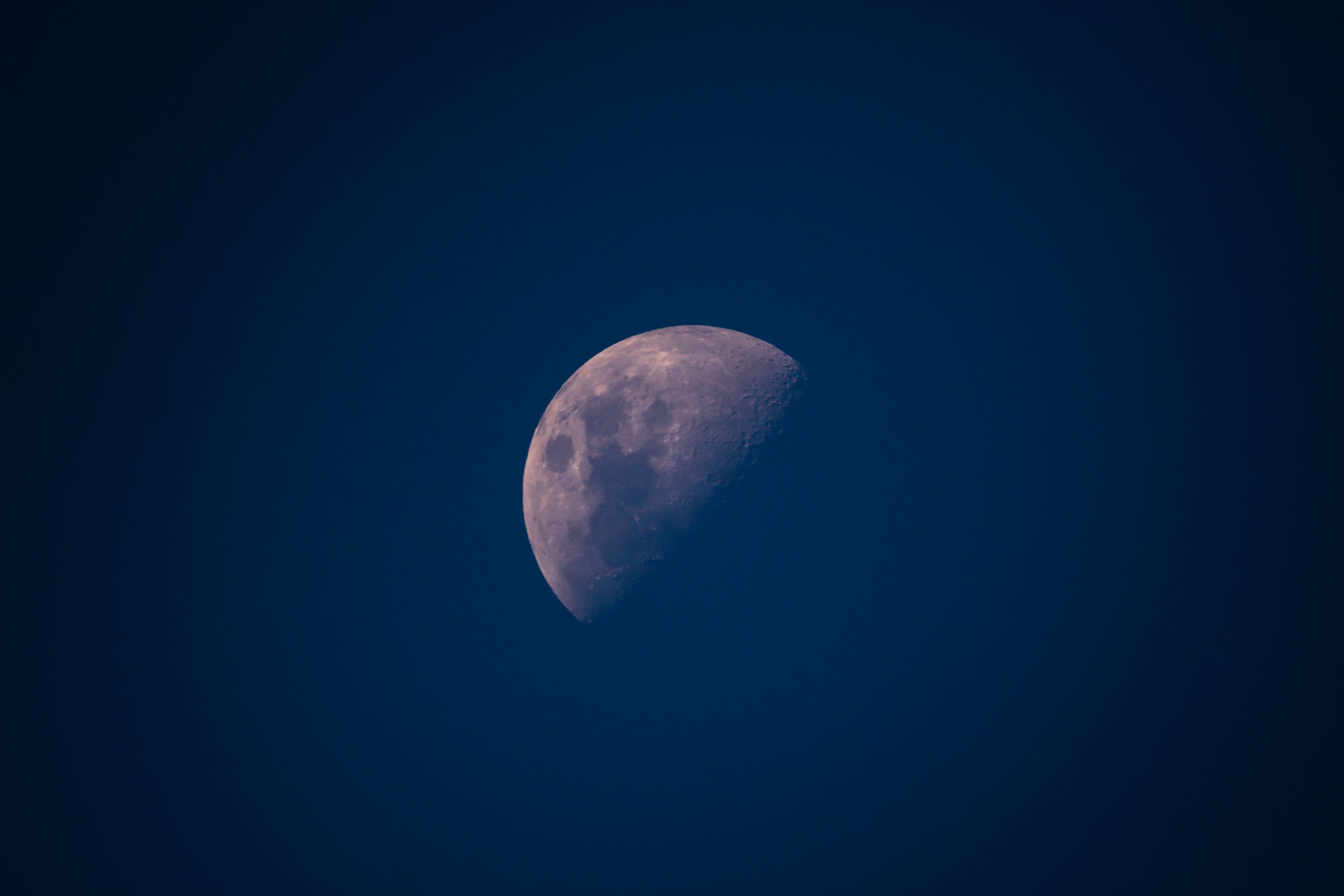Crescent Moon against Deep Blue Night Sky · Free Stock Photo