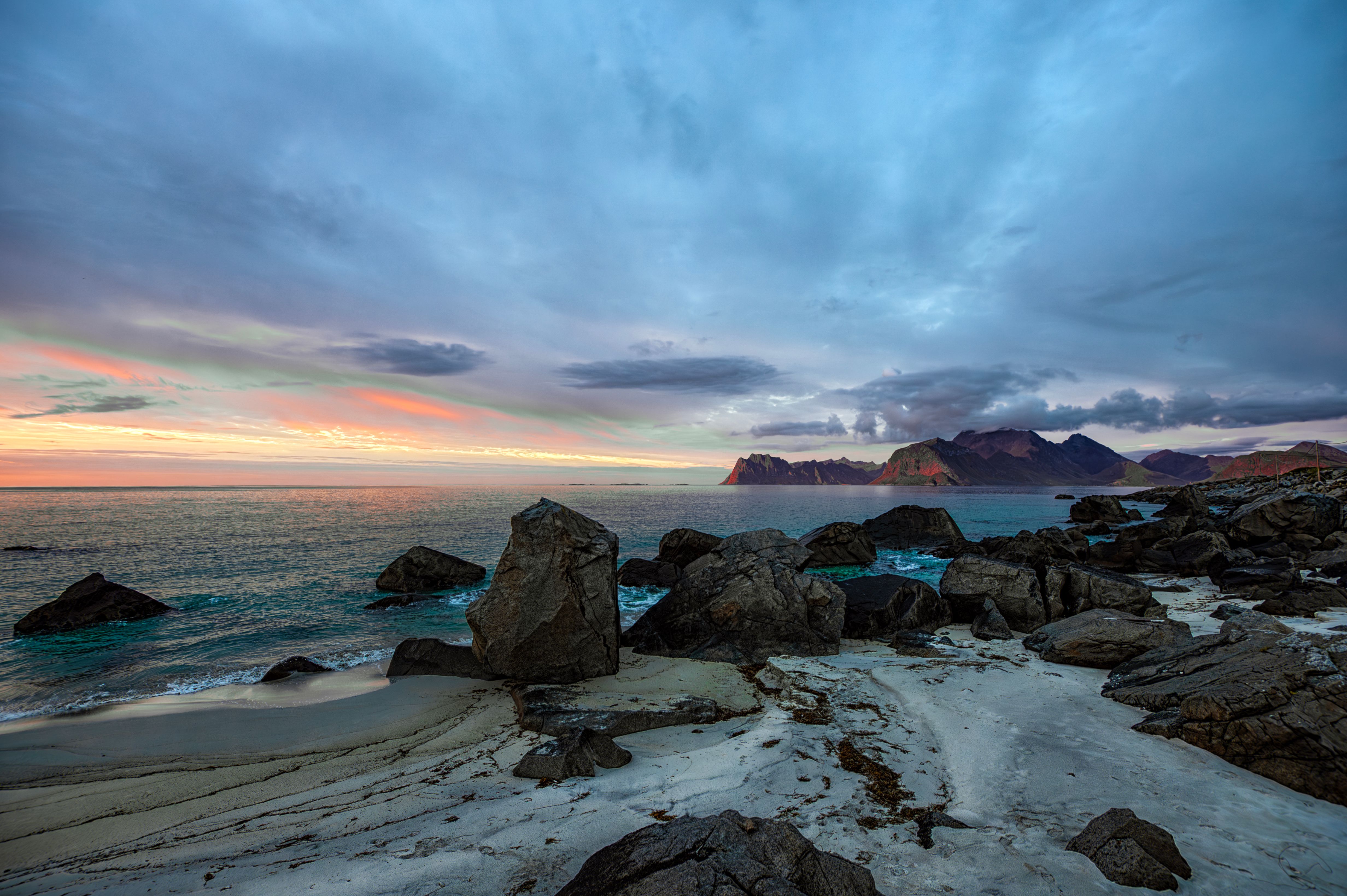 Dramatic Rocky Beach at Sunrise or Sunset · Free Stock Photo
