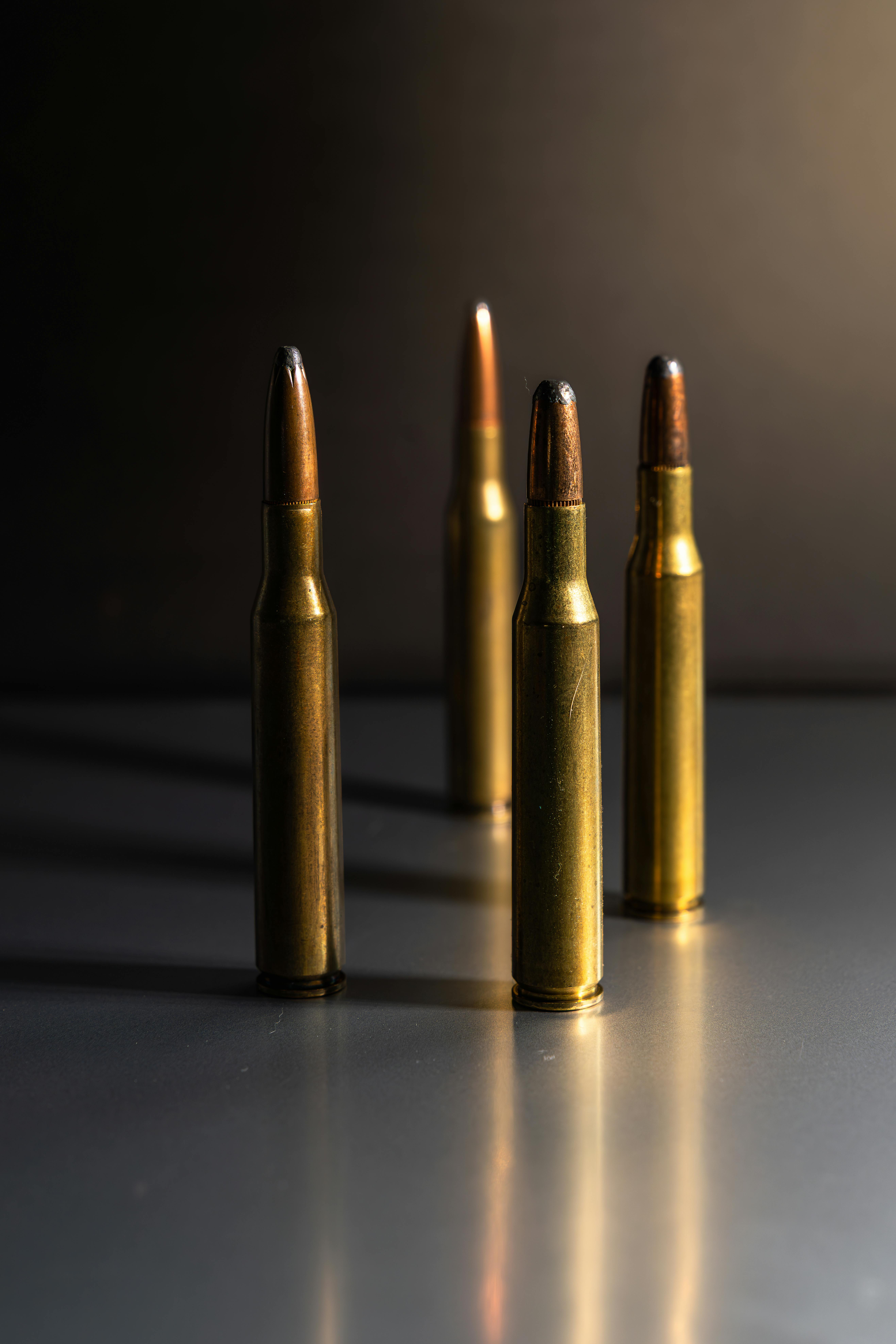 Close Up Photography of Brass Bullets · Free Stock Photo