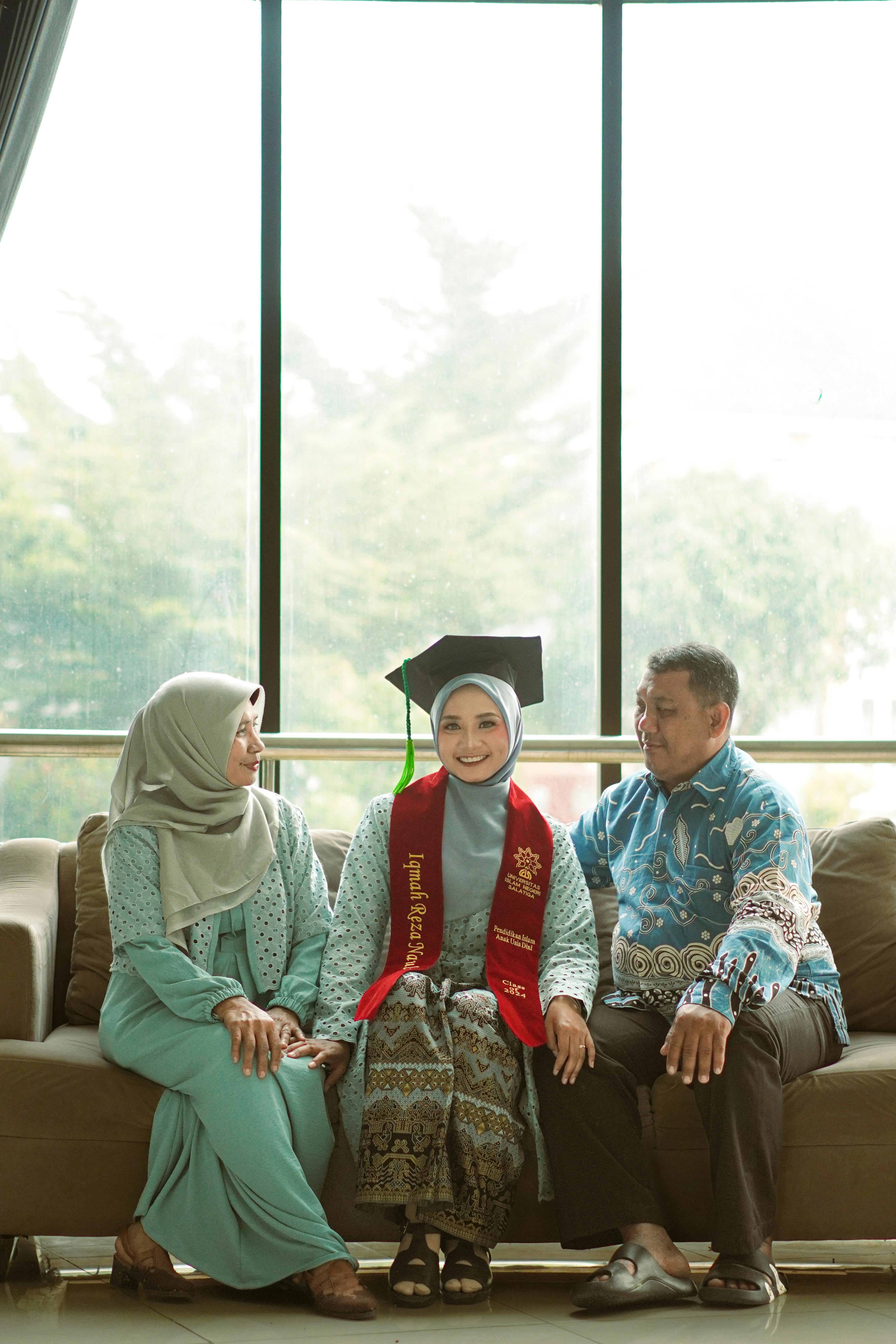 Family Celebrating Graduation Indoors · Free Stock Photo