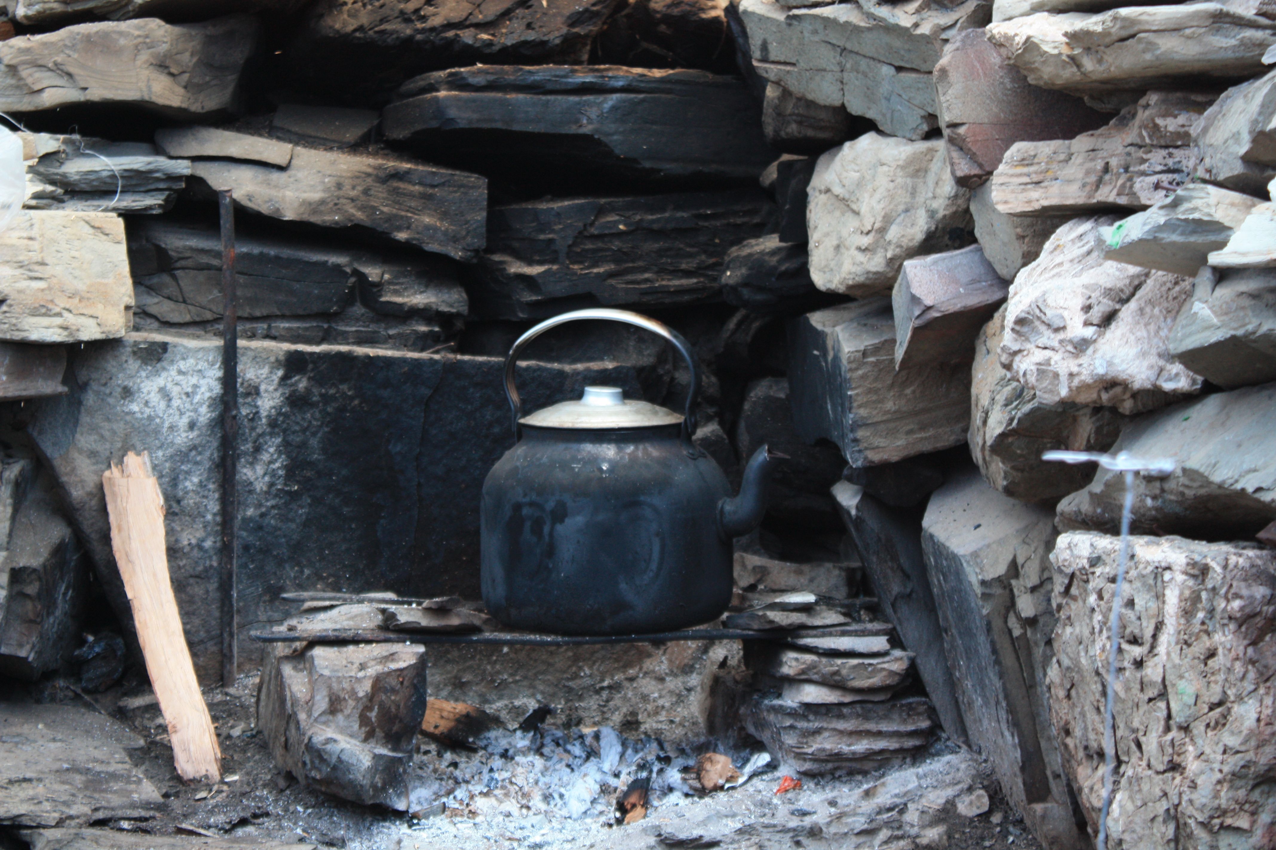 Vintage Kettle on Rustic Stone Fireplace · Free Stock Photo
