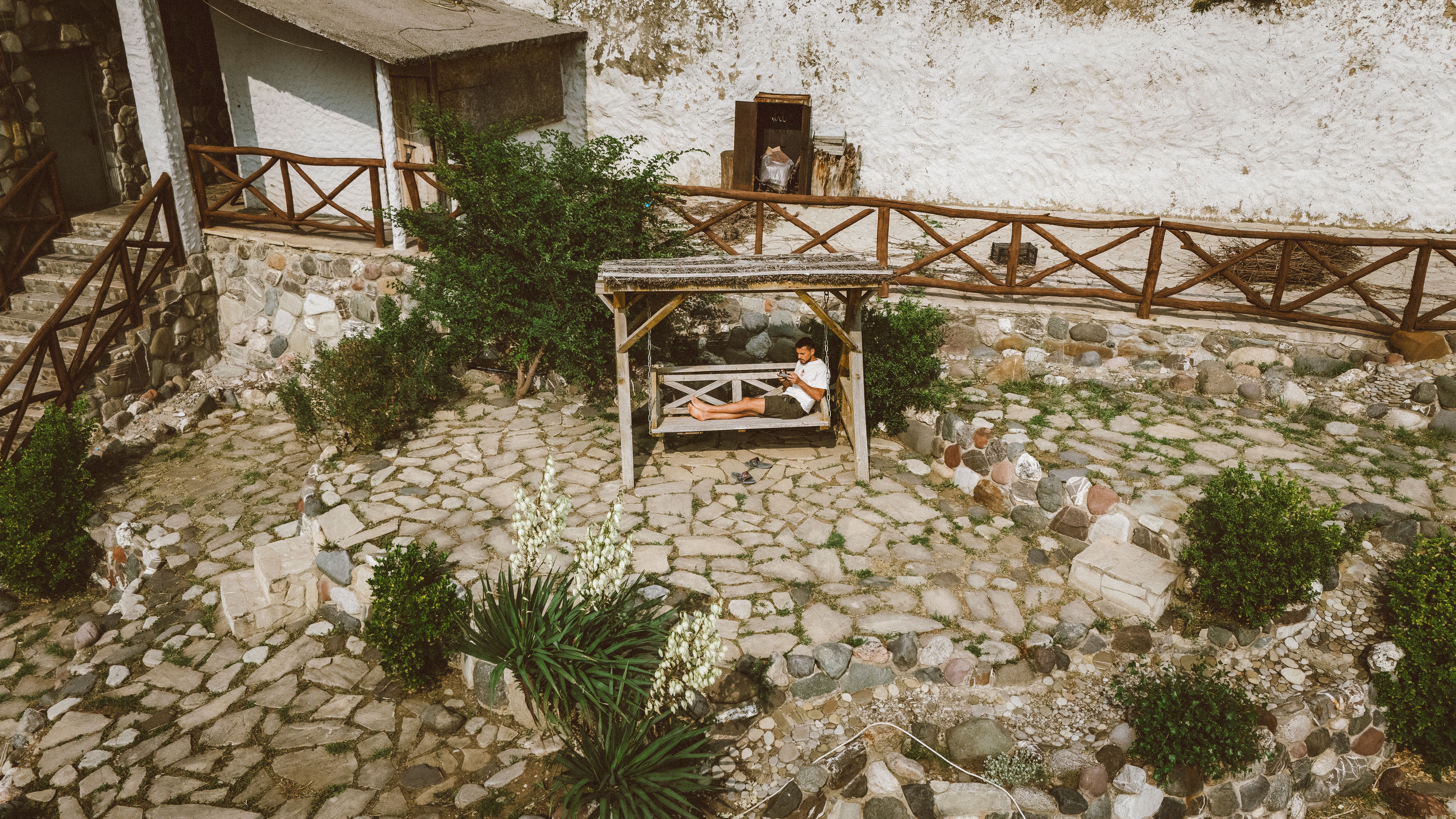 Aerial View of a Relaxing Courtyard Scene in Georgia · Free Stock Photo