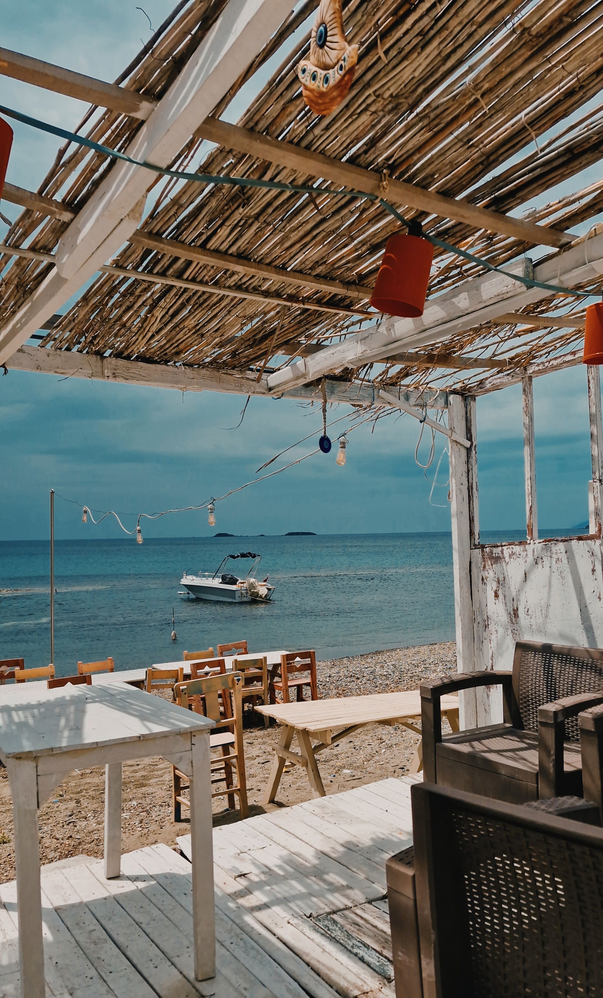 Rustic Beachfront Patio Overlooking Sea · Free Stock Photo
