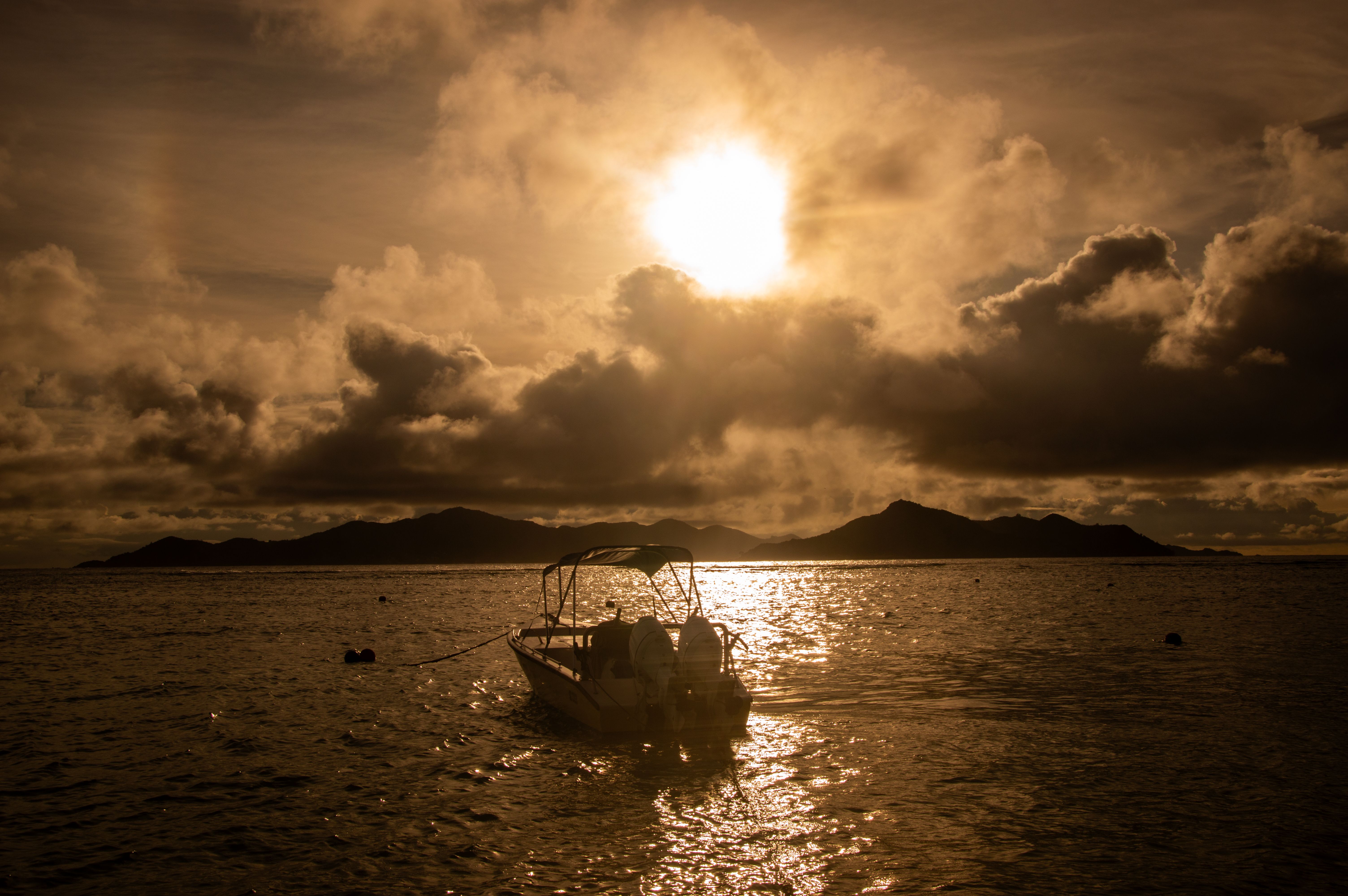 Dramatic Seascape with Boat at Sunset · Free Stock Photo