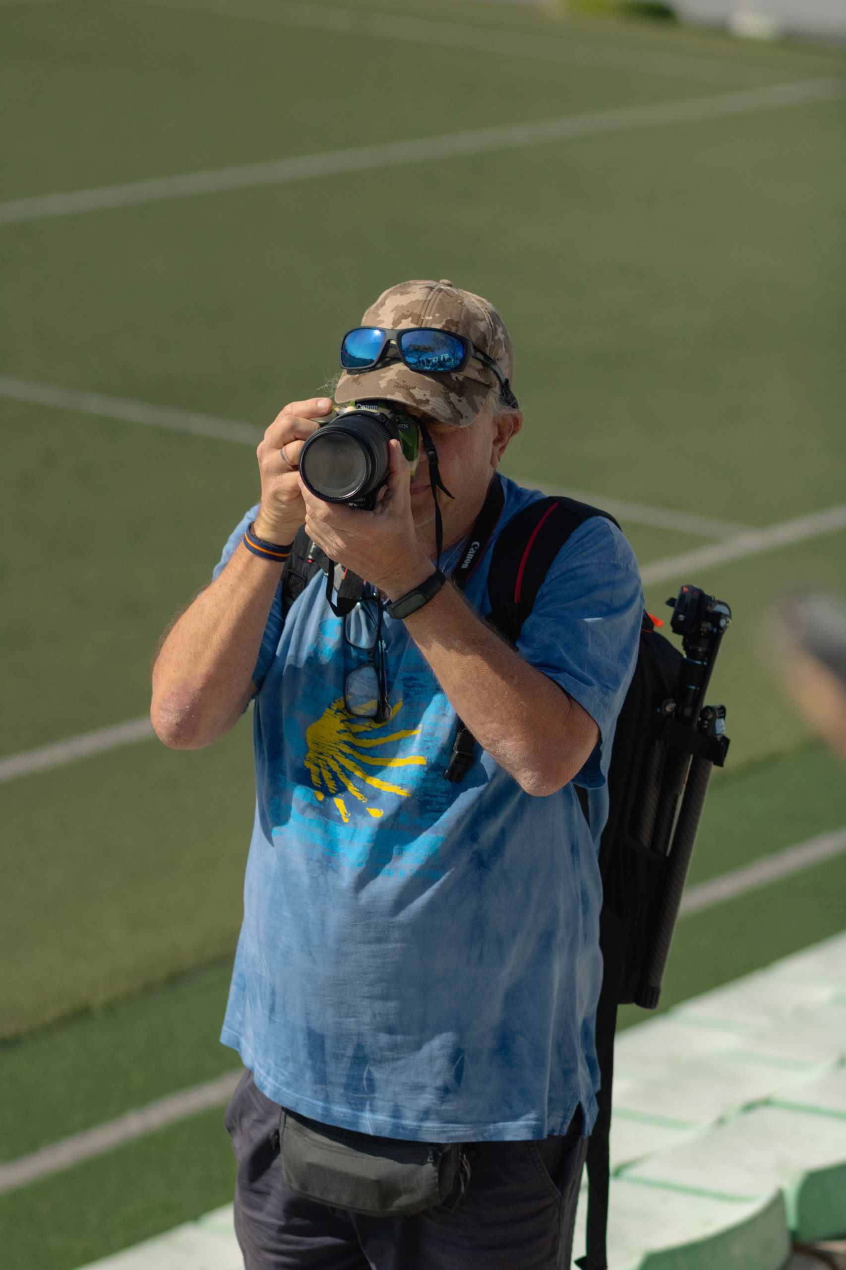 Photographer Capturing Sports Event Outdoors · Free Stock Photo