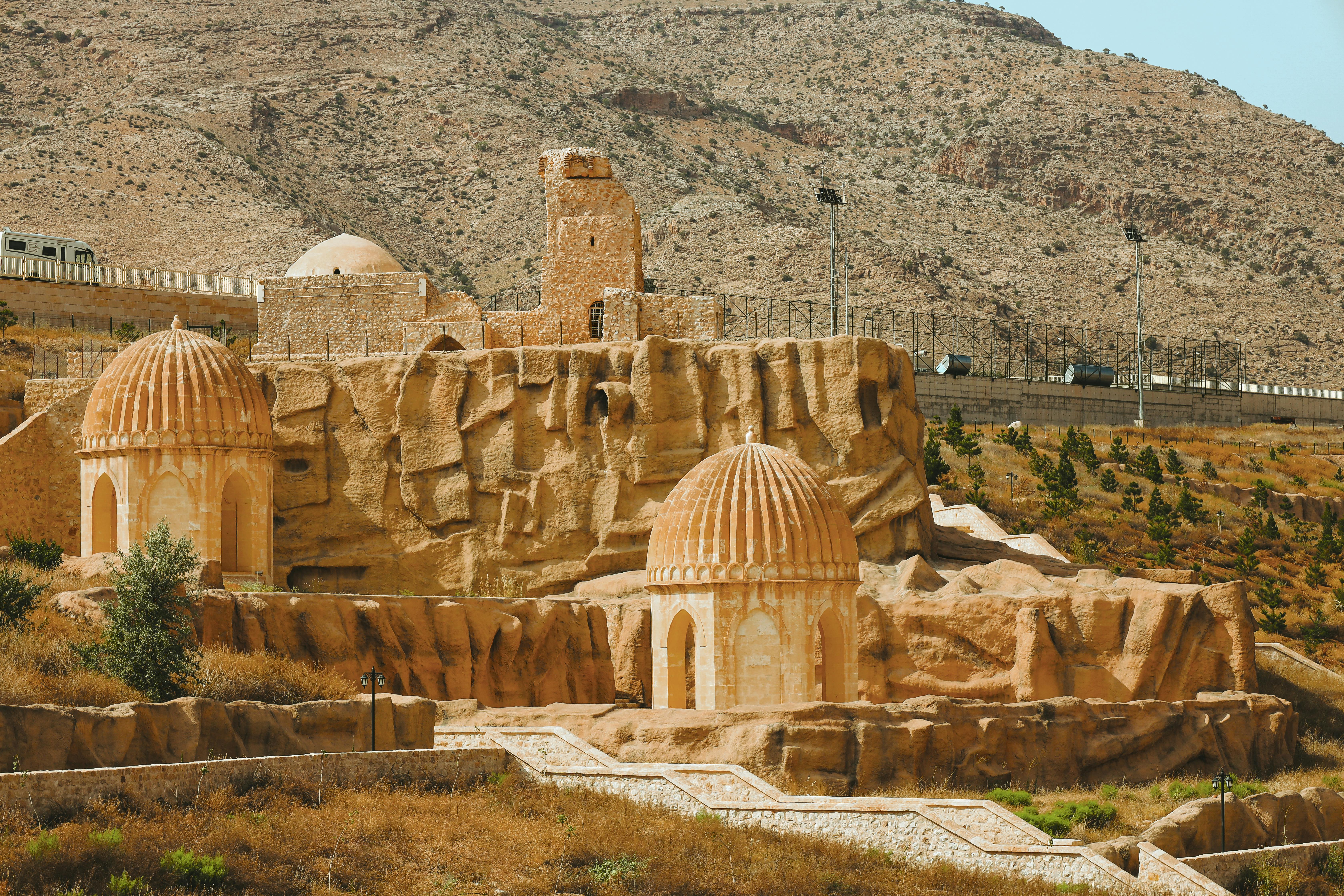 Ancient Stone Structures in Mountainous Landscape · Free Stock Photo