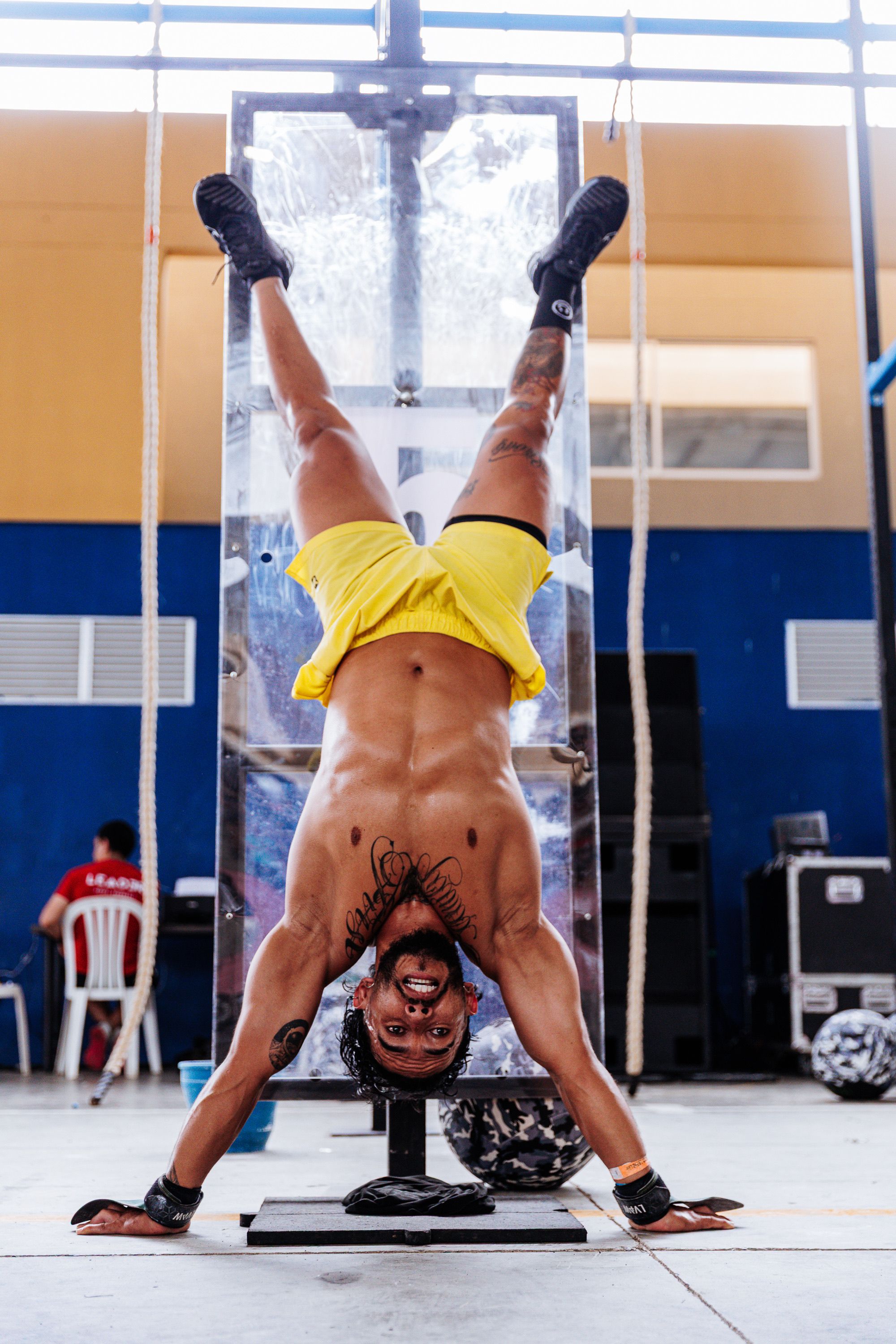 Athletic Man Performing Handstand in Gym · Free Stock Photo