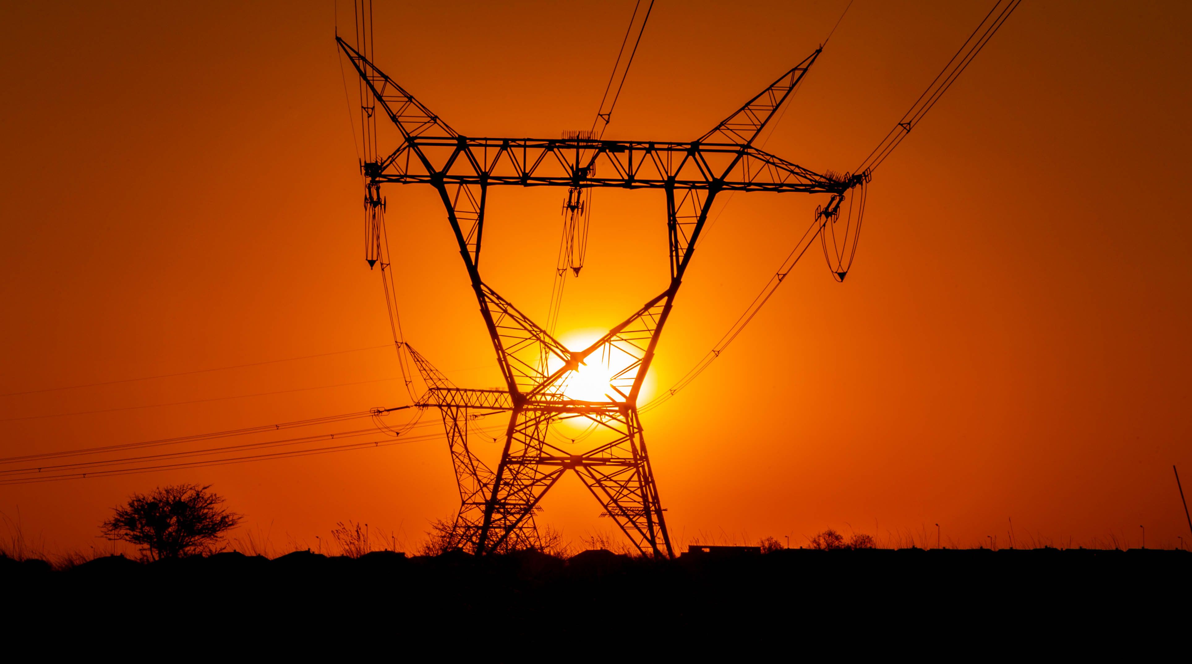 Vibrant Sunset Behind Electric Power Lines · Free Stock Photo