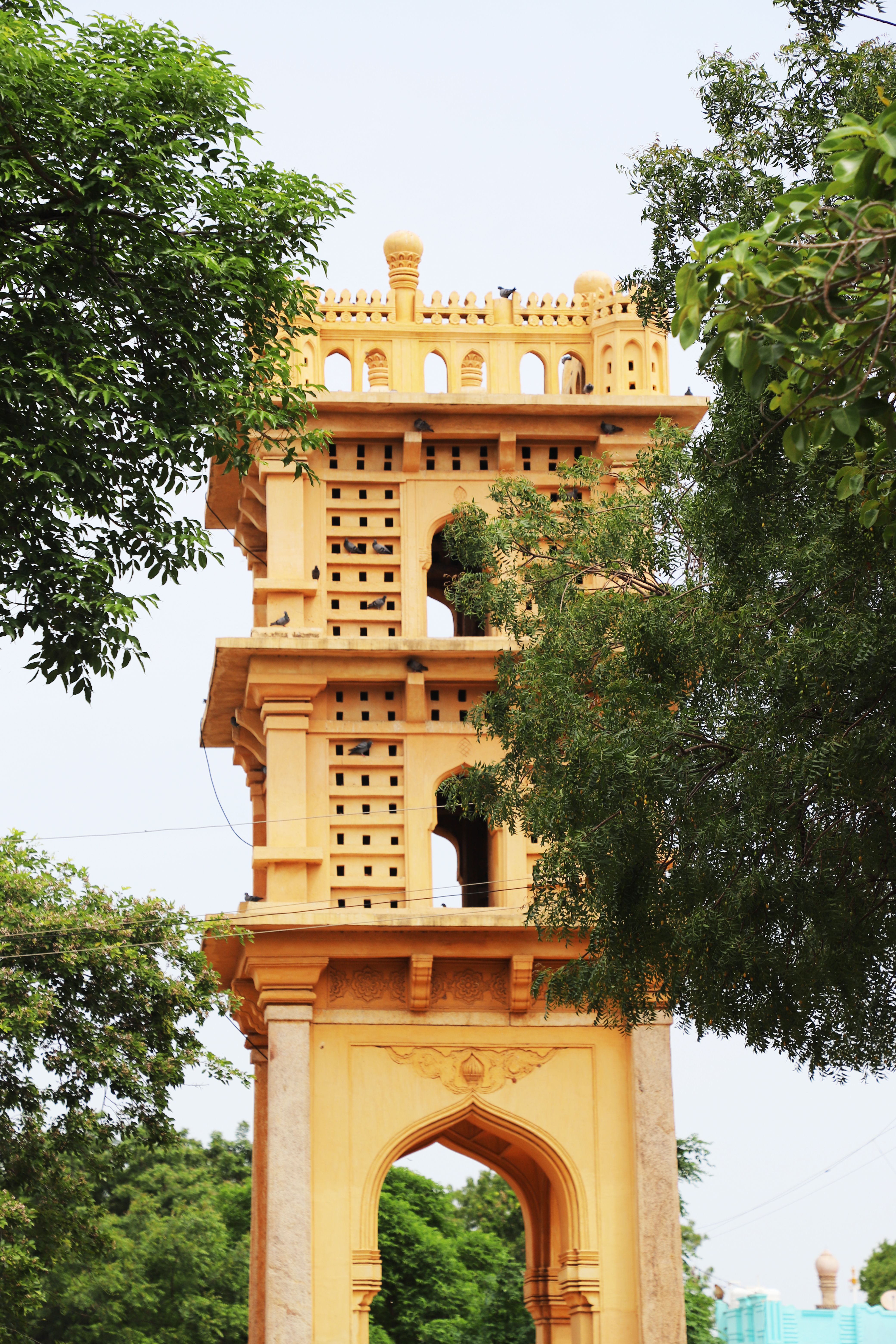 Historic Yellow Tower Amidst Greenery · Free Stock Photo